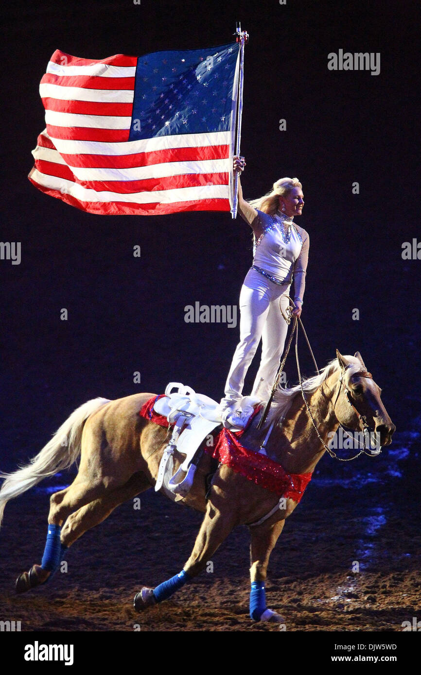 March 2 2010: A rider carries the American Flag during the National ...