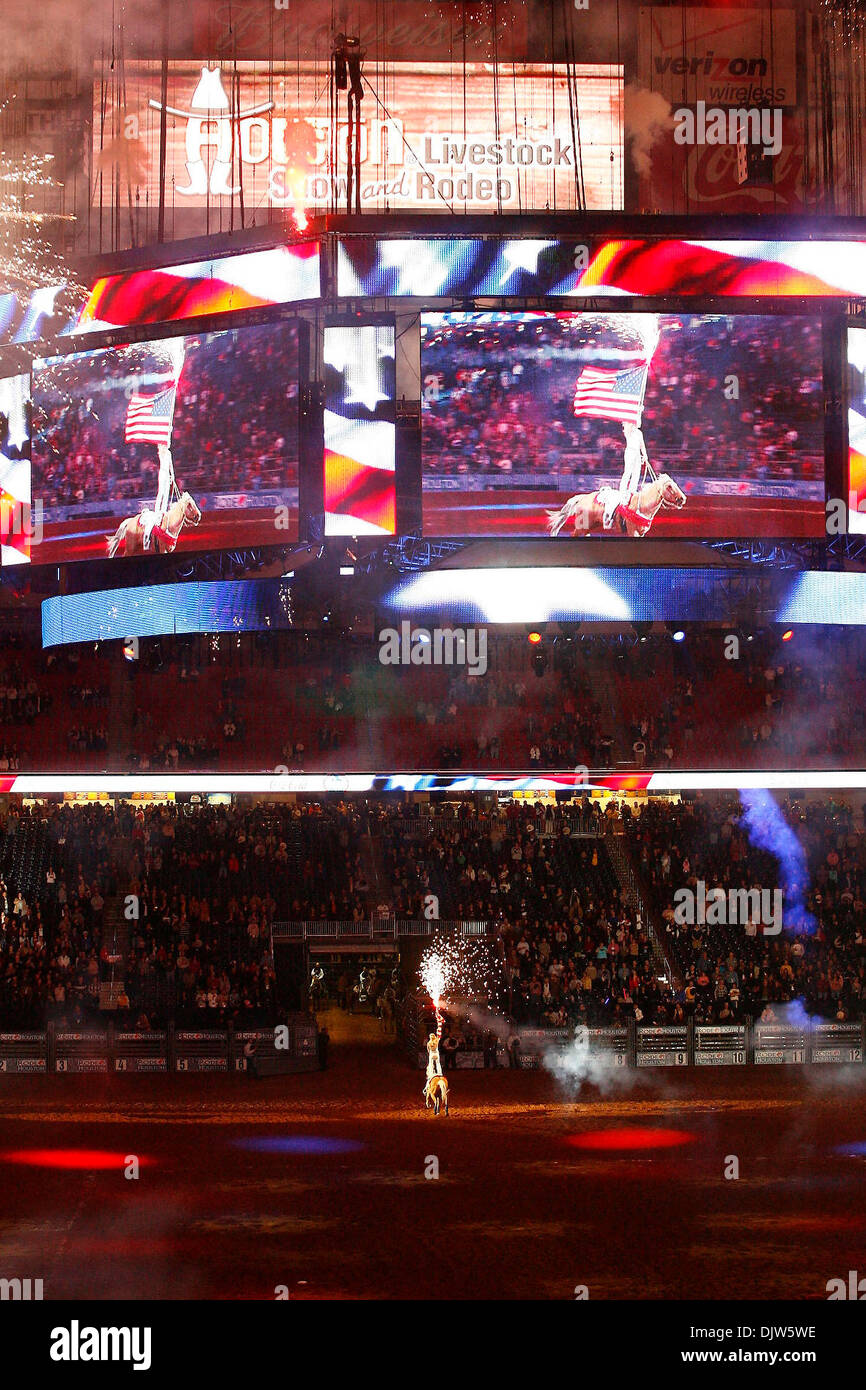 March 2 2010: A rider carries the American Flag during the National ...