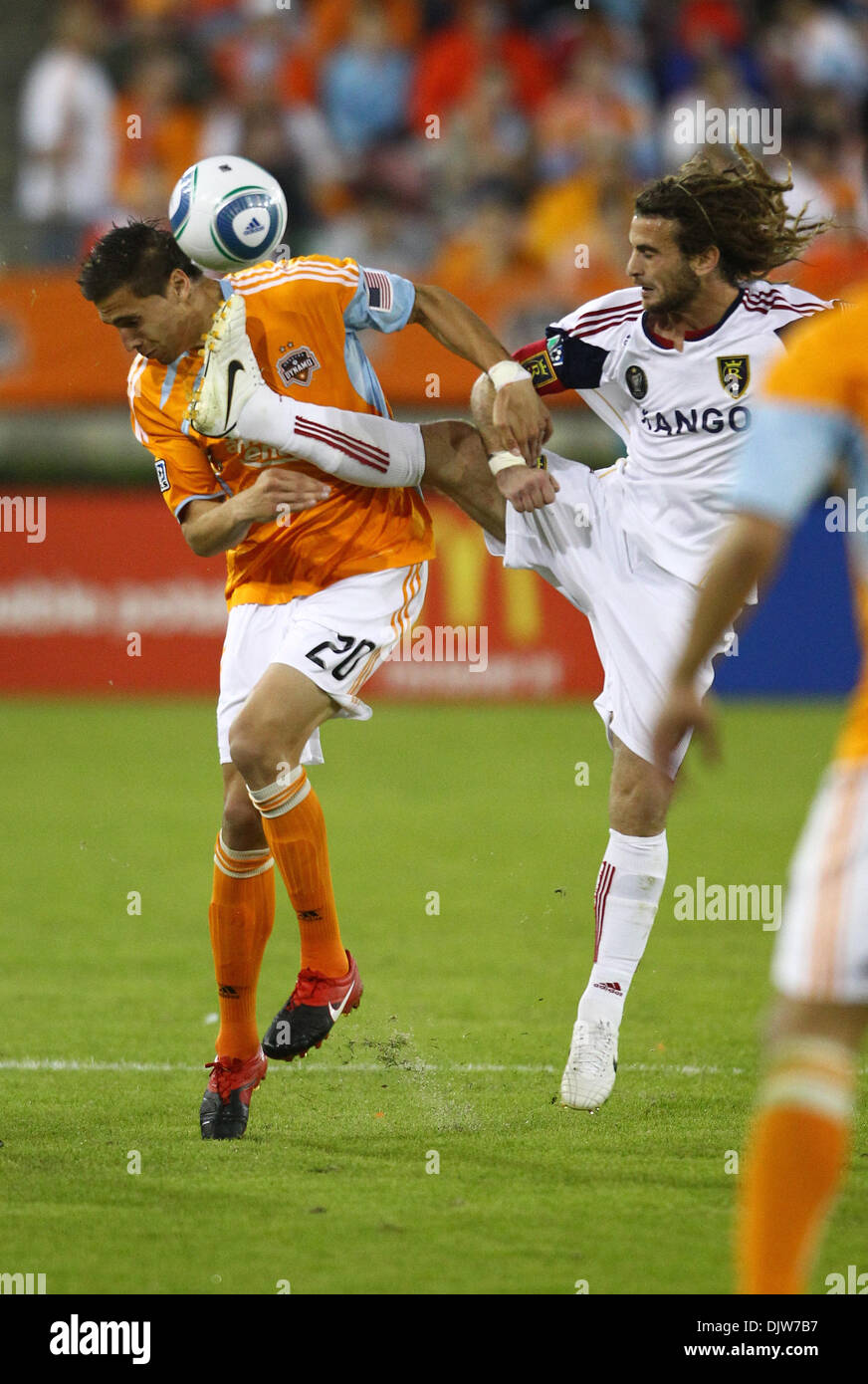 Geoff Cameron (#20) for the Houston Dynamo is kicked in the face by ...