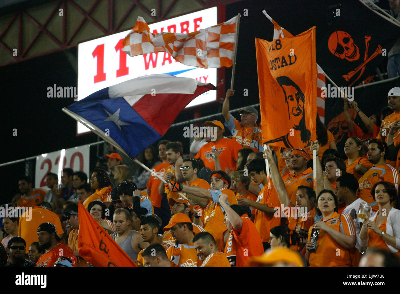 Houston Dynamo fans wave flags in the stand in support of the team ...