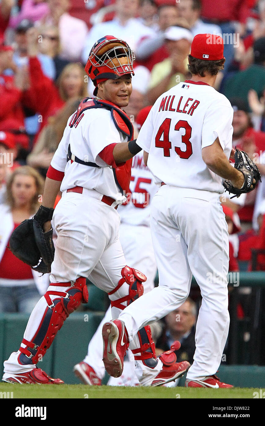 St. Louis Cardinals catcher Yadier Molina (4) bumps fists with St ...