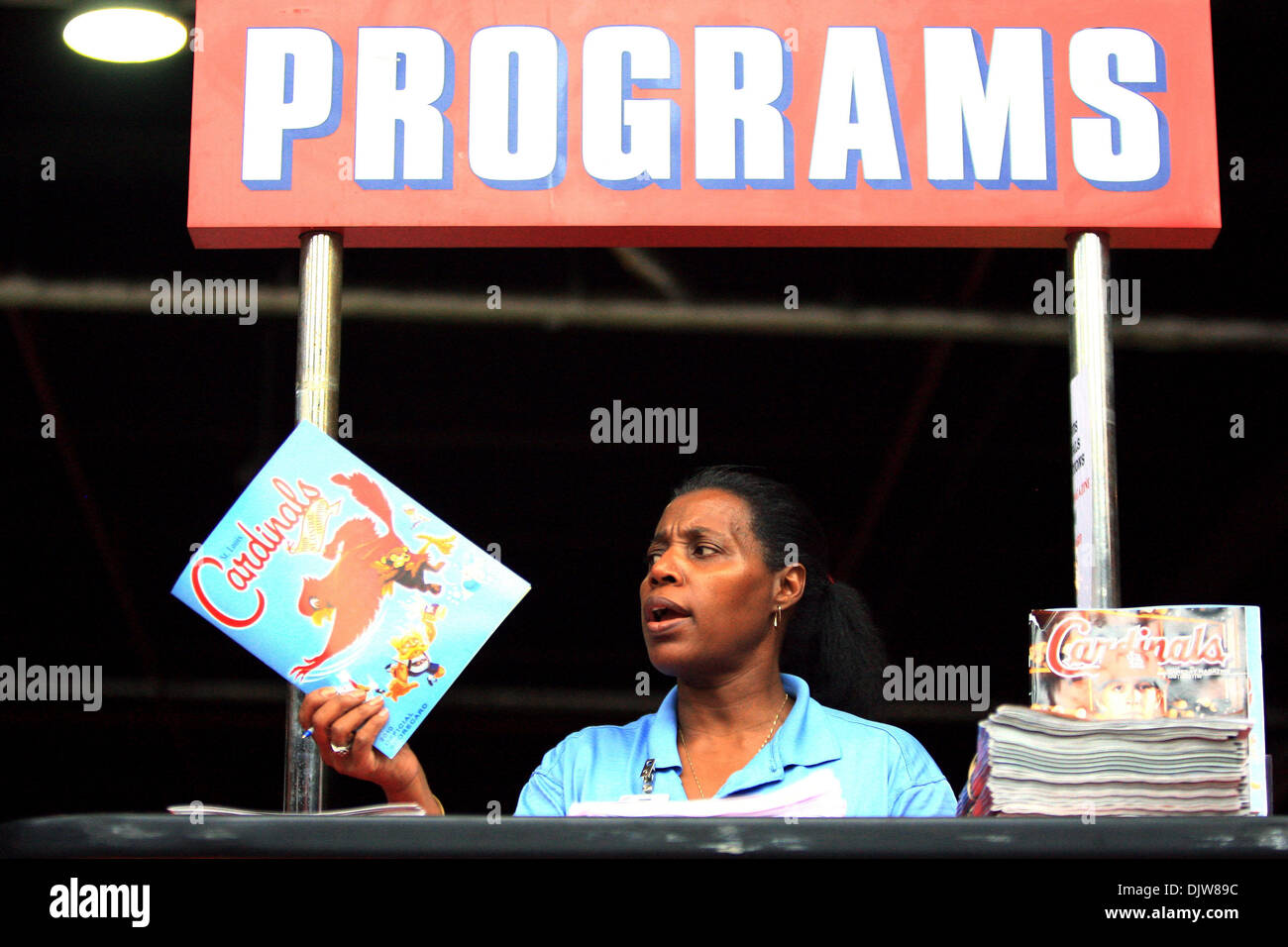 A Busch Stadium Greeter greets entering fans with a chant of ''Programs ...