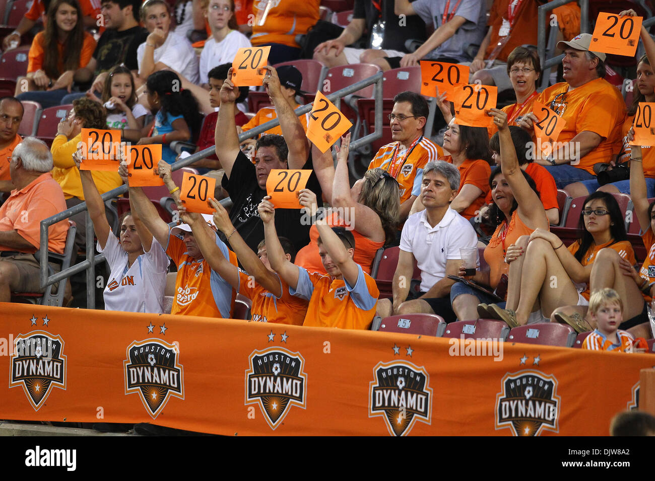 At 20 minutes into the first half fans held up signs with the #20 ...