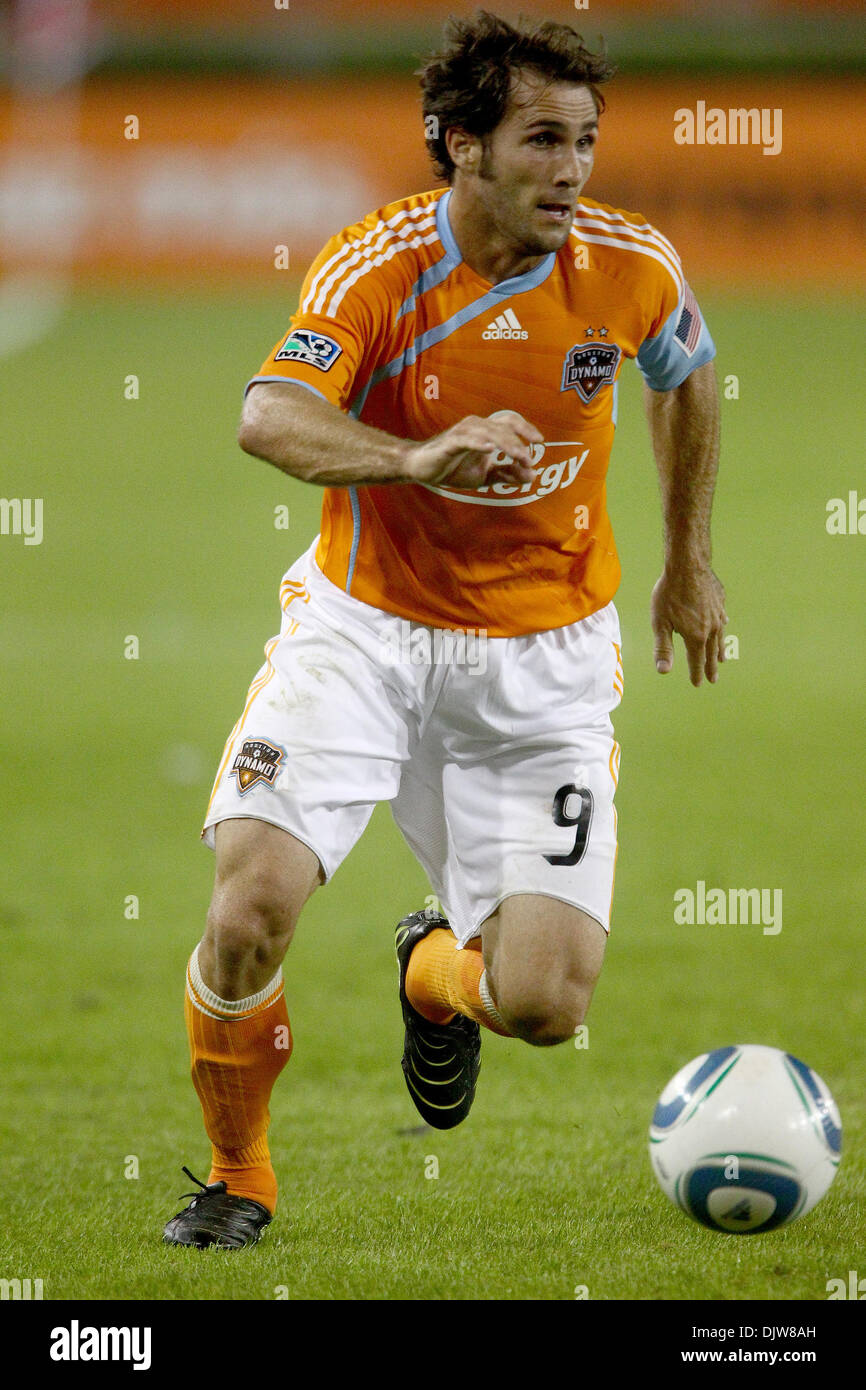 Brian Mullan (#9) Midfielder for the Houston Dynamo dribbles the ball ...