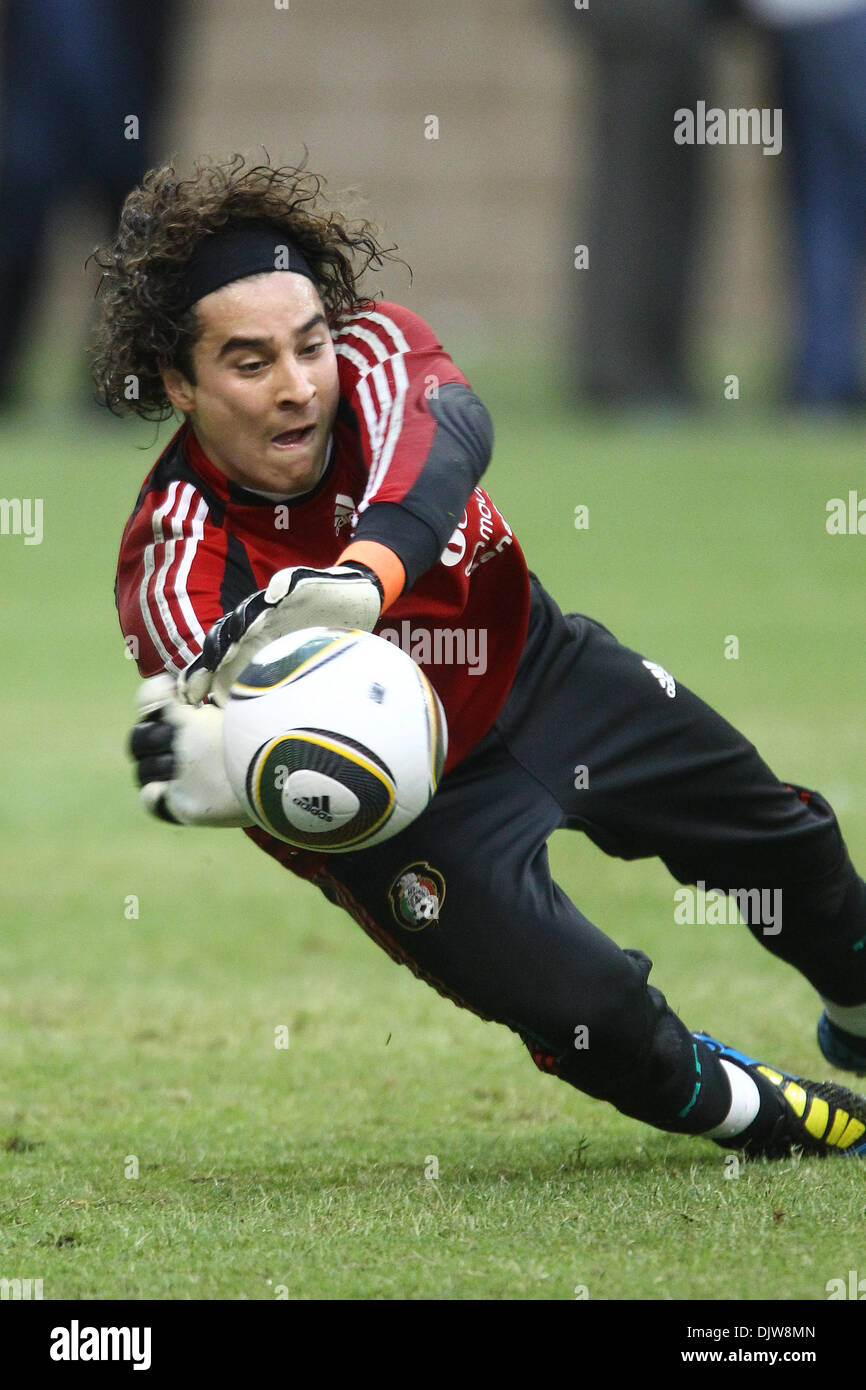 Guillermo Ochoa (#1) Goalkeeper for Mexico dives to the right to save a ...