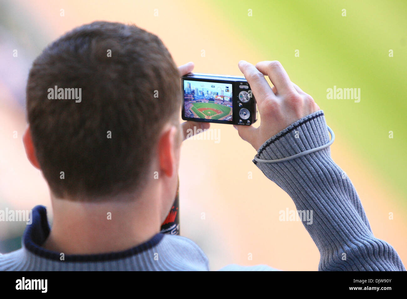 A fan takes a picture of Busch Stadium from the upper deck during the ...