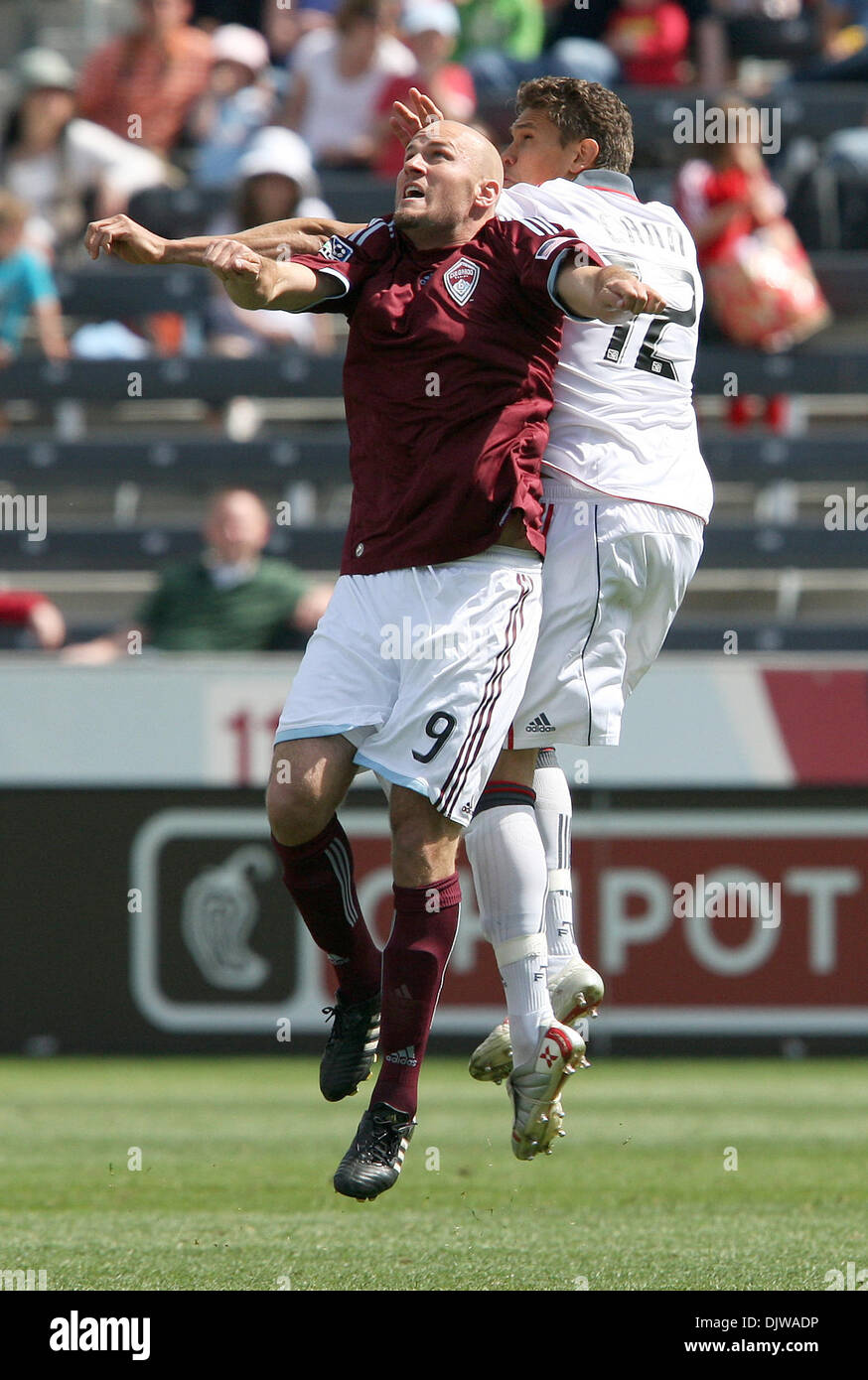 Rapids' forward Conor Casey (9) and Toronto's defender Adrian Cann (12 ...