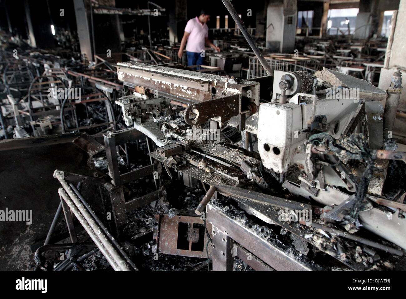 Burnt garments are seen after a fire 10-storey garment building complex ...