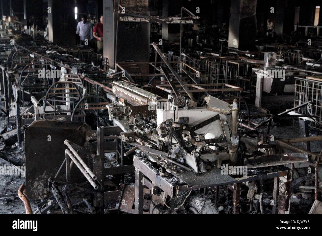 Burnt garments are seen after a fire 10-storey garment building complex ...