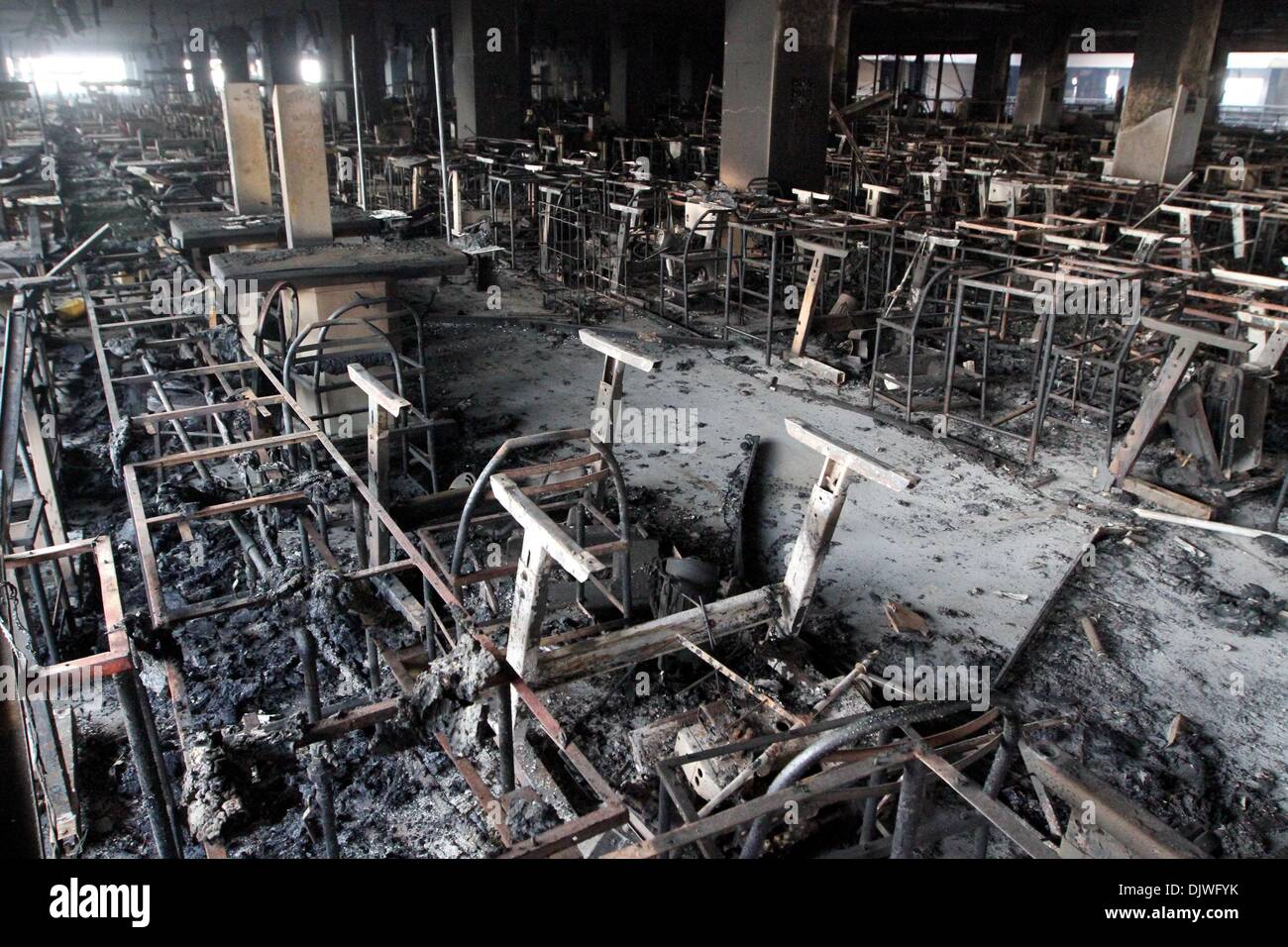 Burnt garments are seen after a fire 10-storey garment building complex ...