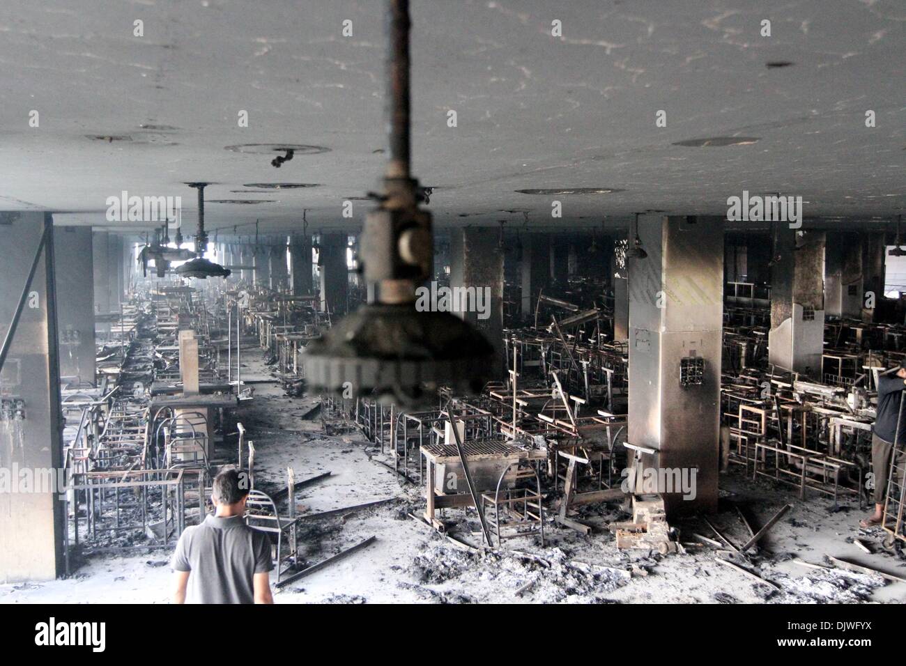 Burnt garments are seen after a fire 10-storey garment building complex ...