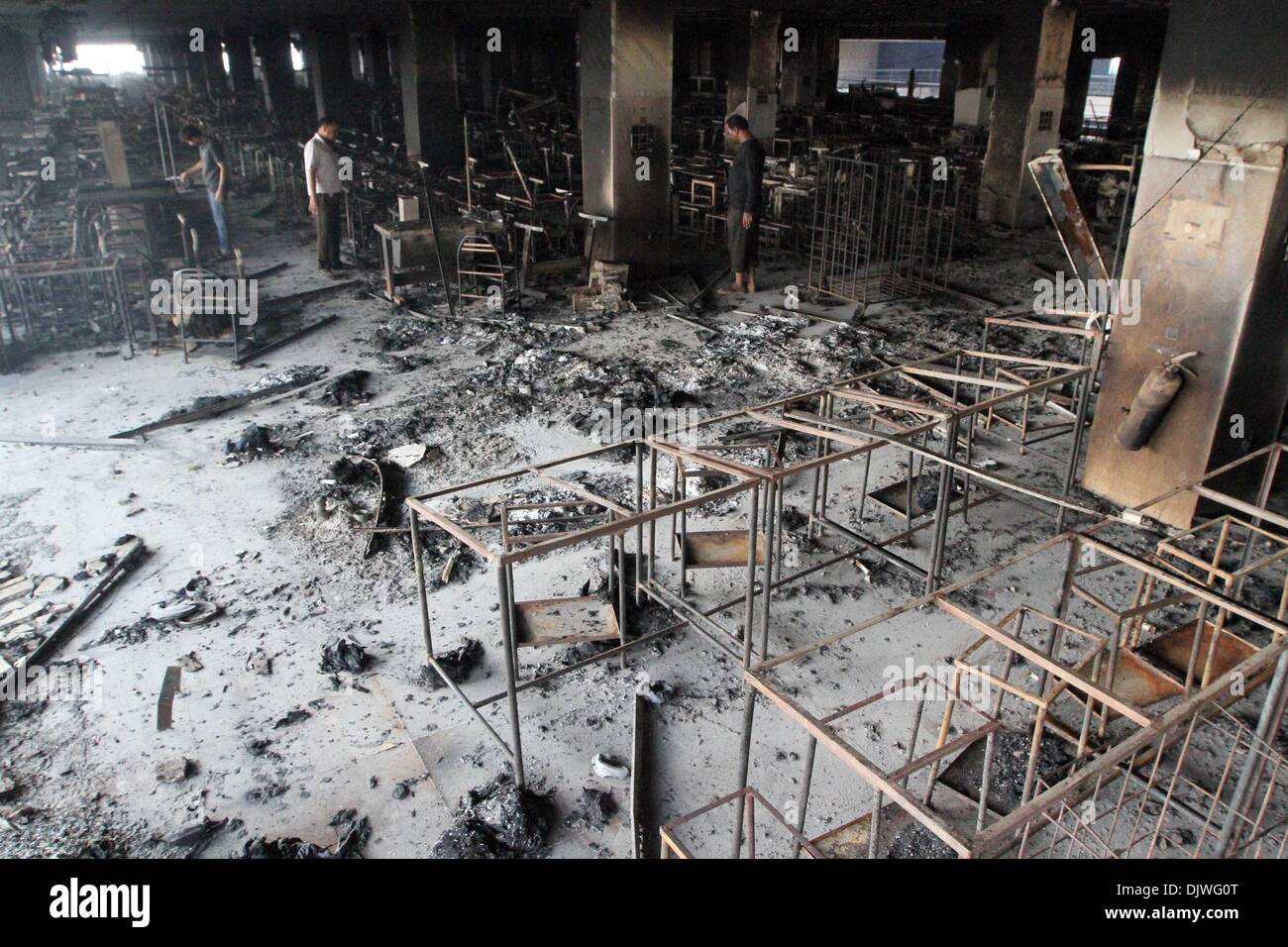 Burnt garments are seen after a fire 10-storey garment building complex ...