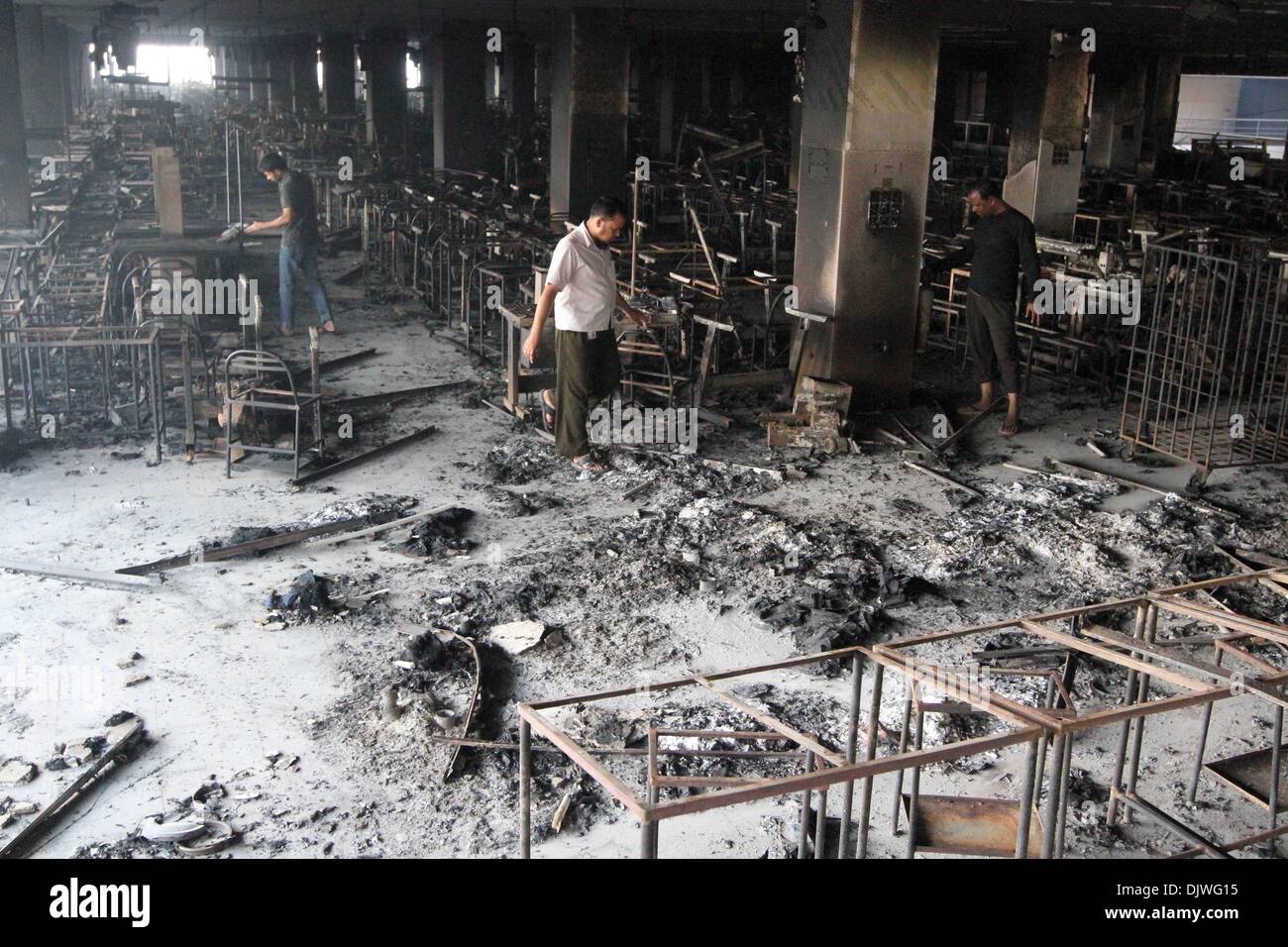 Burnt garments are seen after a fire 10-storey garment building complex ...