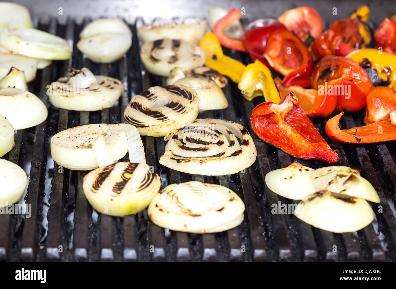 cooking vegetables on the grill in the kitchen at the restaurant Stock ...