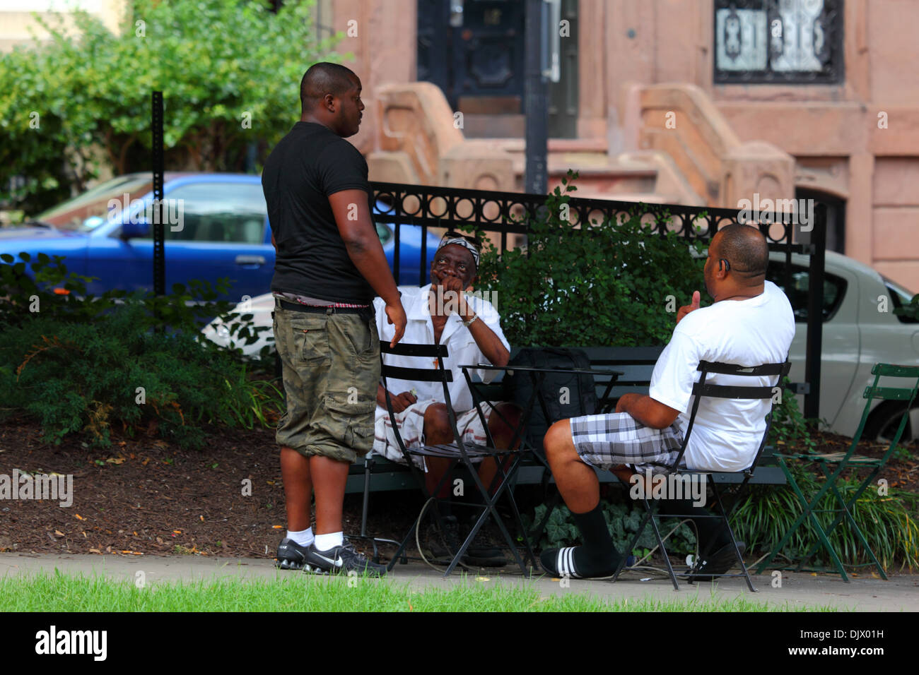 African American locals chatting in park, Mount Vernon Place, Baltimore ...