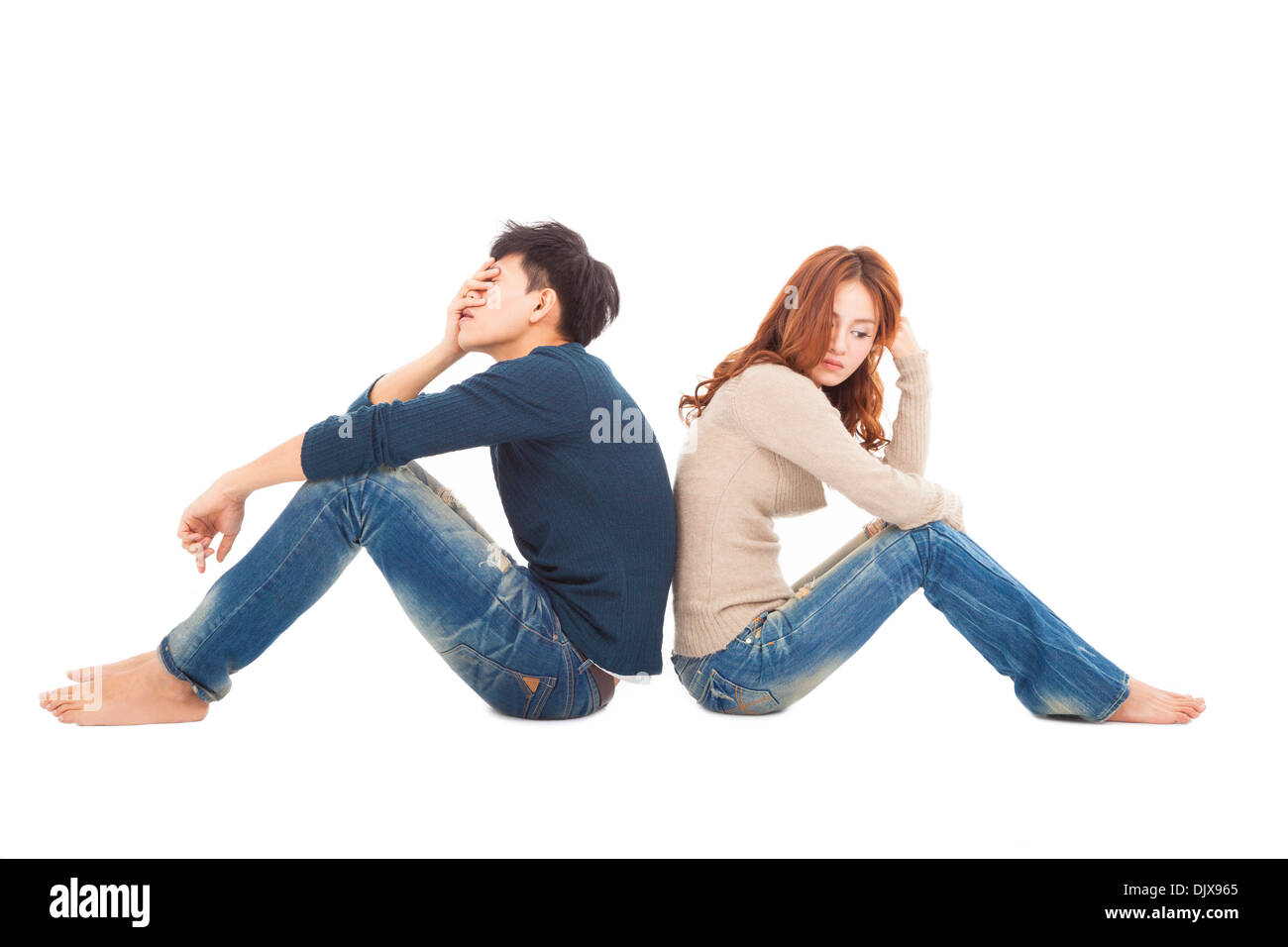 young Couple sitting back to back during conflict Stock Photo - Alamy