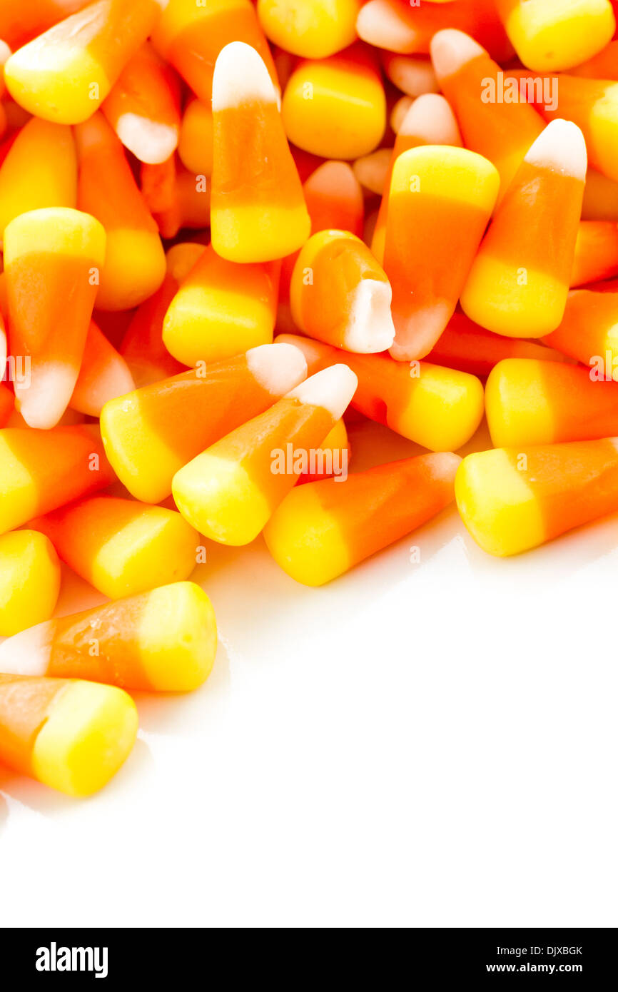 Halloween candy-corn on a white background Stock Photo - Alamy