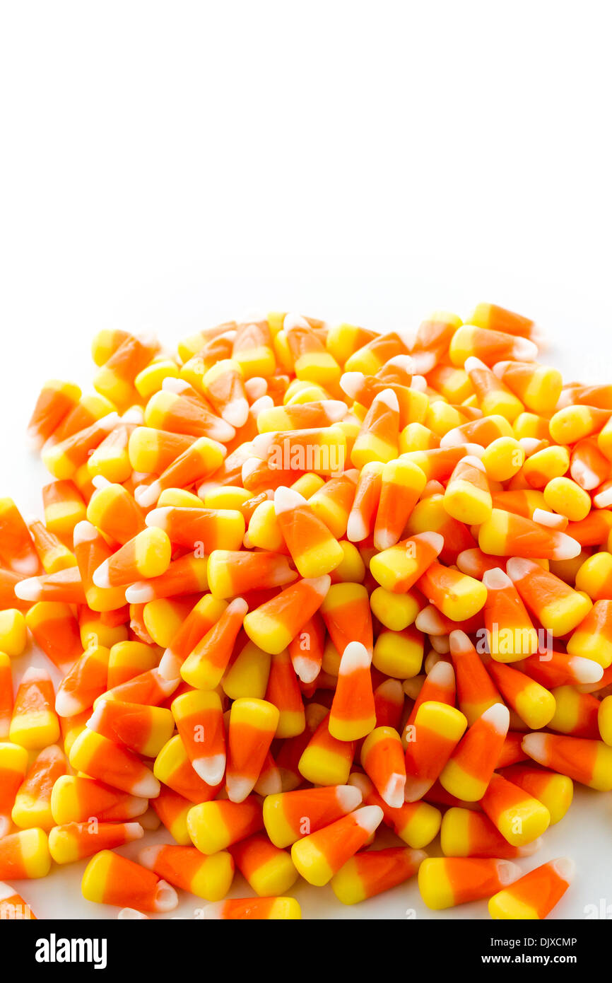 Halloween candy-corn on a white background Stock Photo - Alamy