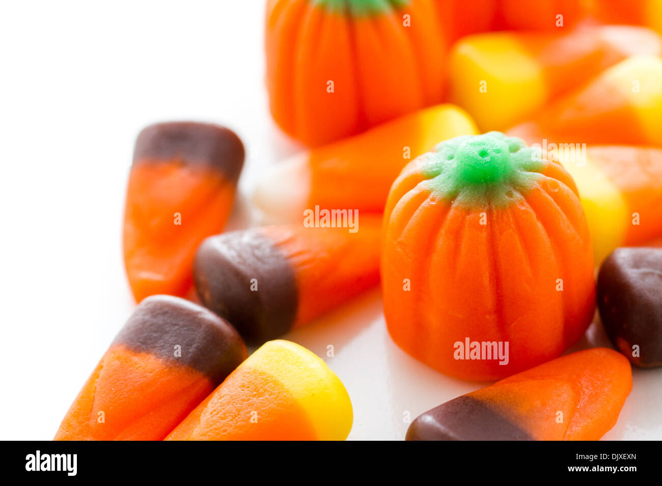 Halloween candy-corn and pumpkins in a pile Stock Photo - Alamy