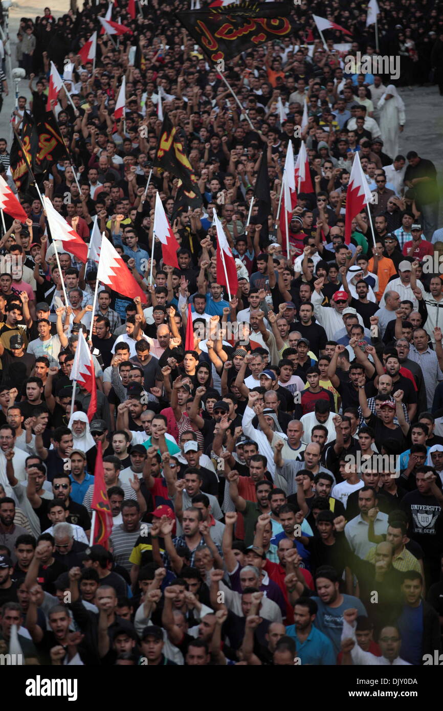 Manama, Bahrain. 30th Nov 2013. People take part in an anti-government ...
