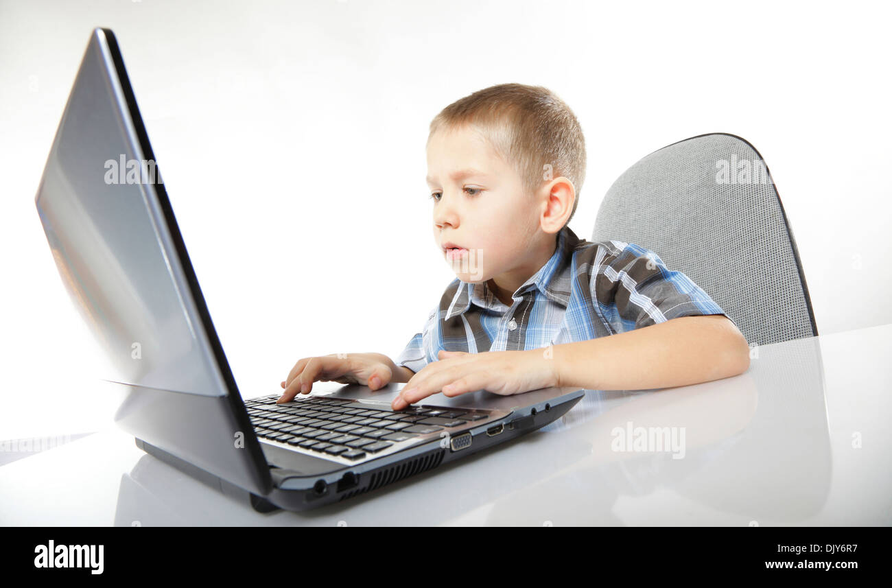 Computer addiction child boy with laptop notebook white background ...