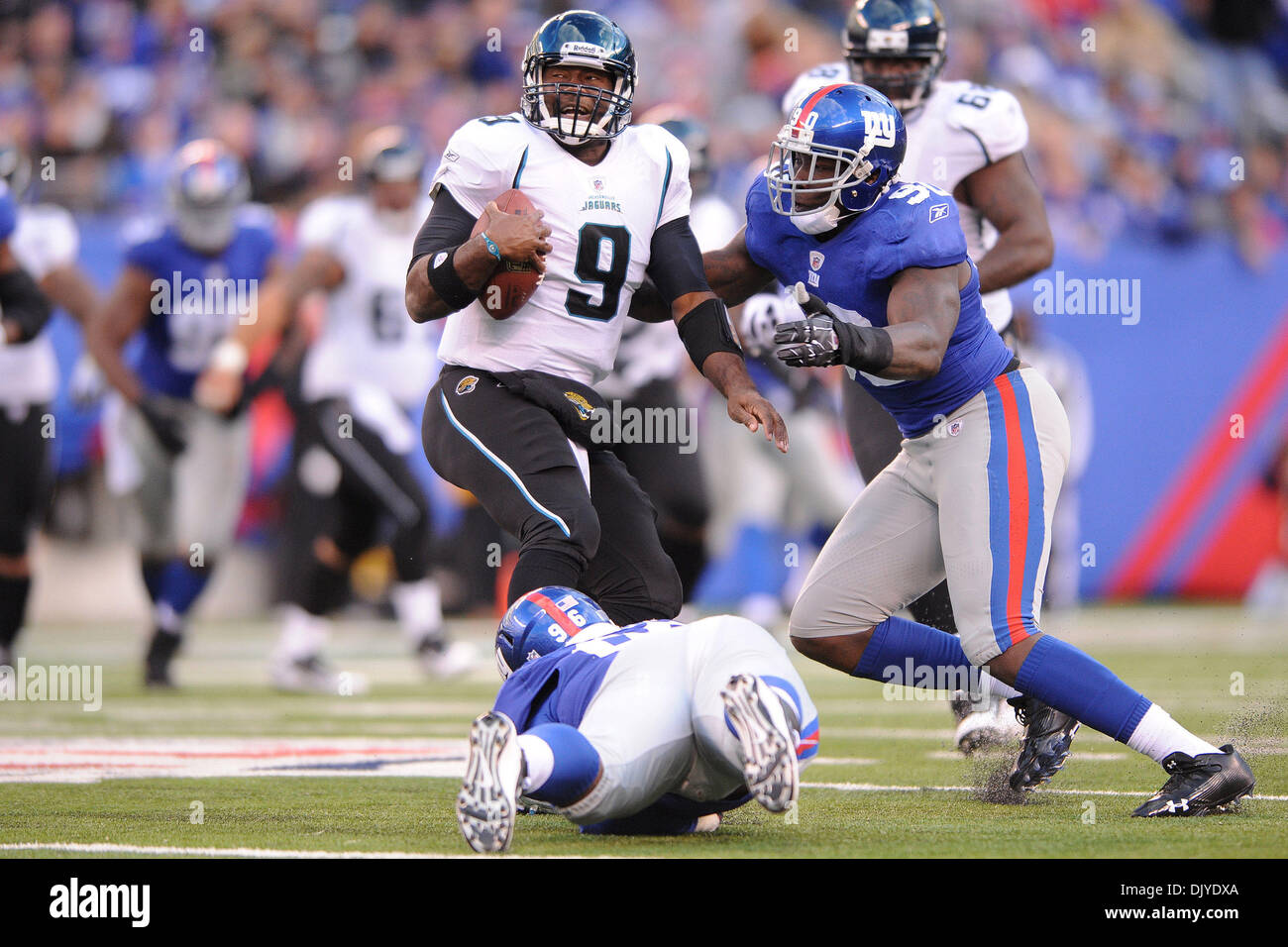 Jacksonville Jaguars quarterback David Garrard (9) tries in vain to ...
