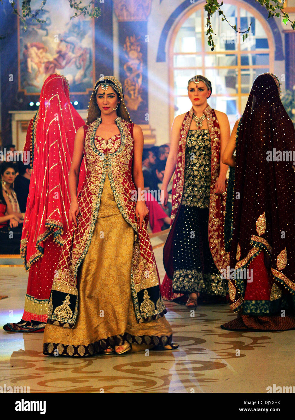 Lahore, Pakistan. 30th Nov 2013. Models present creations by designer ...