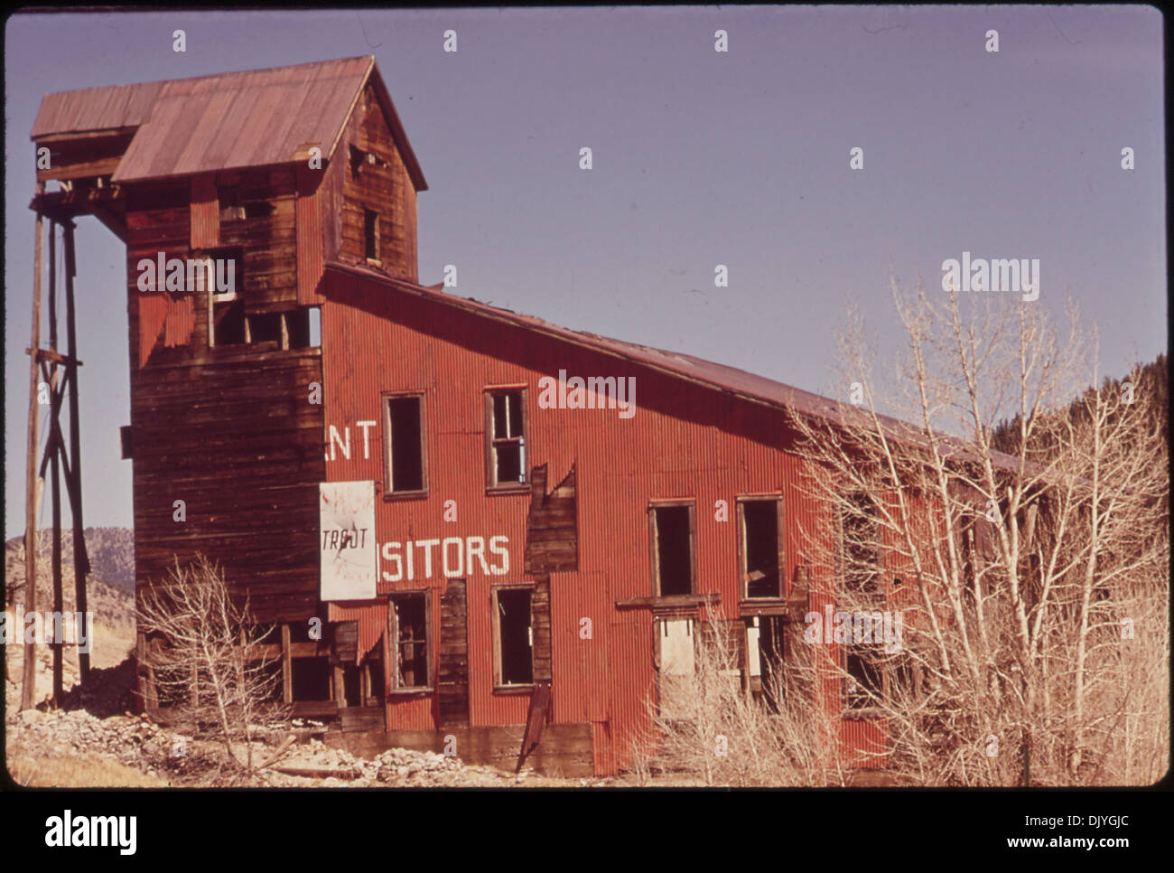This image depicts an abandoned building, capturing the decay and ...
