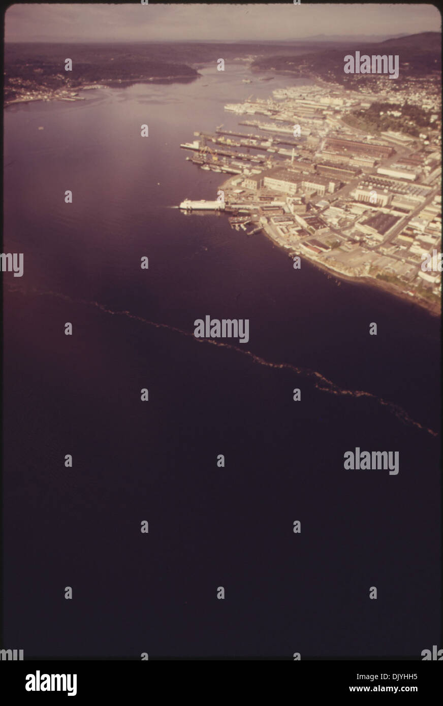 This aerial view shows the head of Sinclair Inlet, including the ...