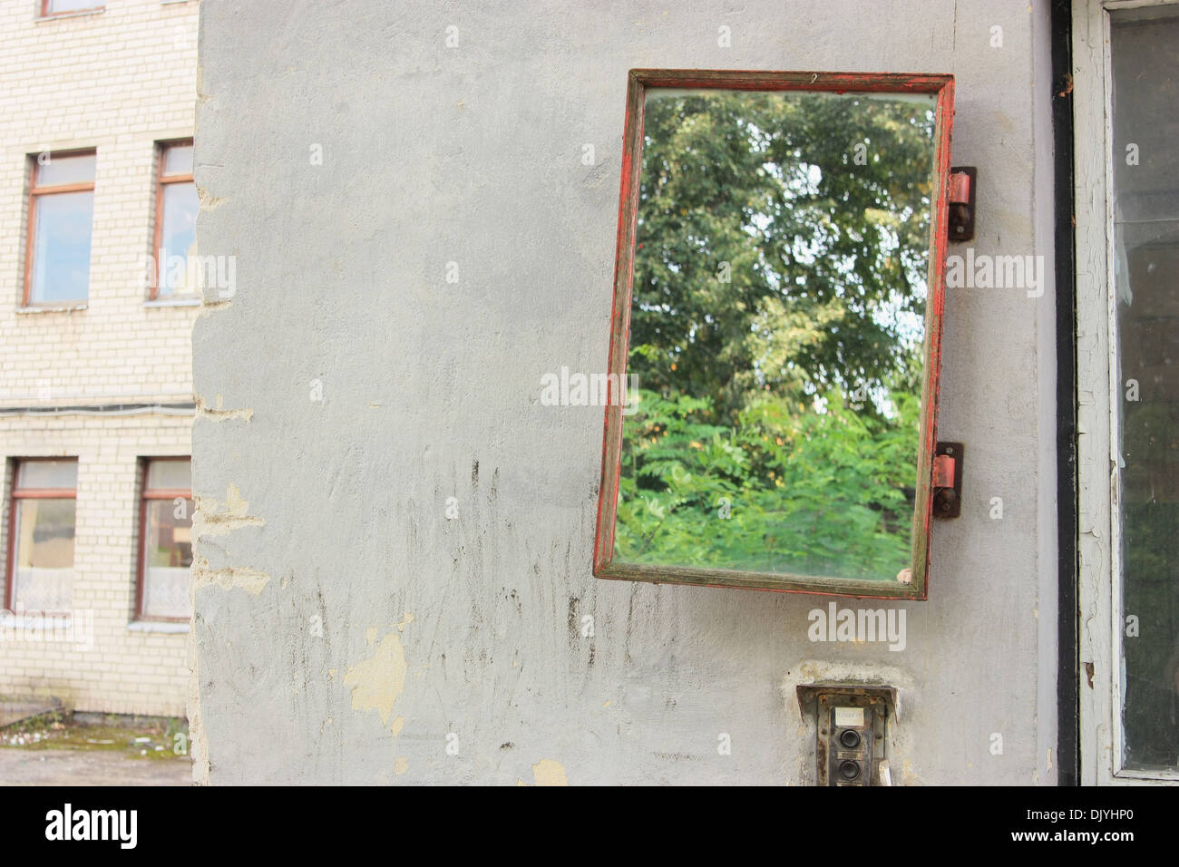 Mirror on the building wall Stock Photo - Alamy