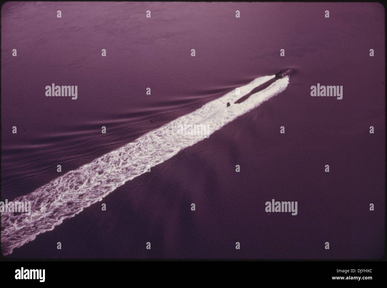 This aerial view shows a Polaris submarine transiting Puget Sound, with ...