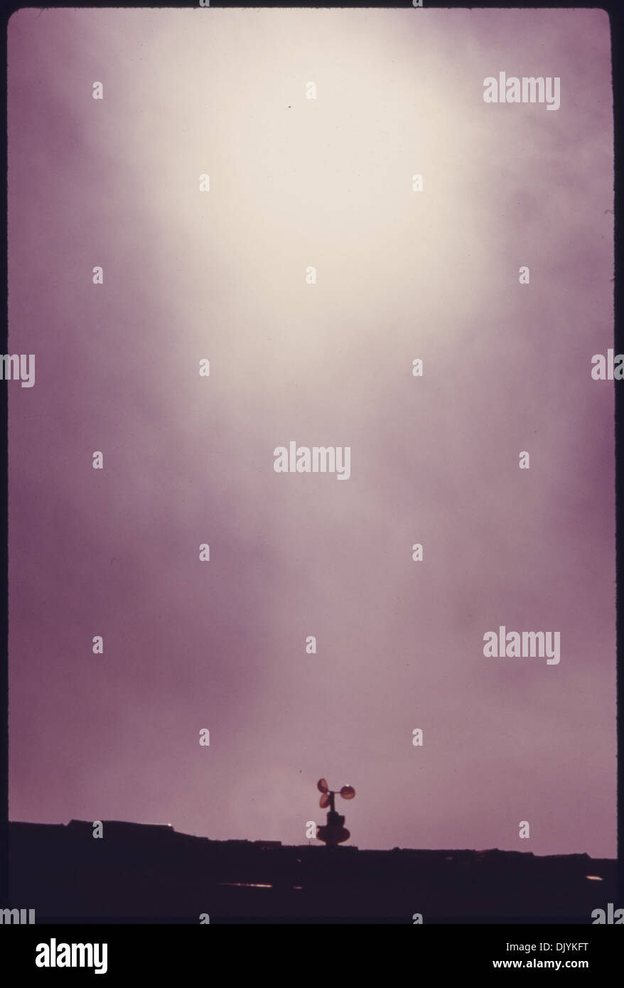 This image shows an anemometer installed on the roof of a solar heating ...