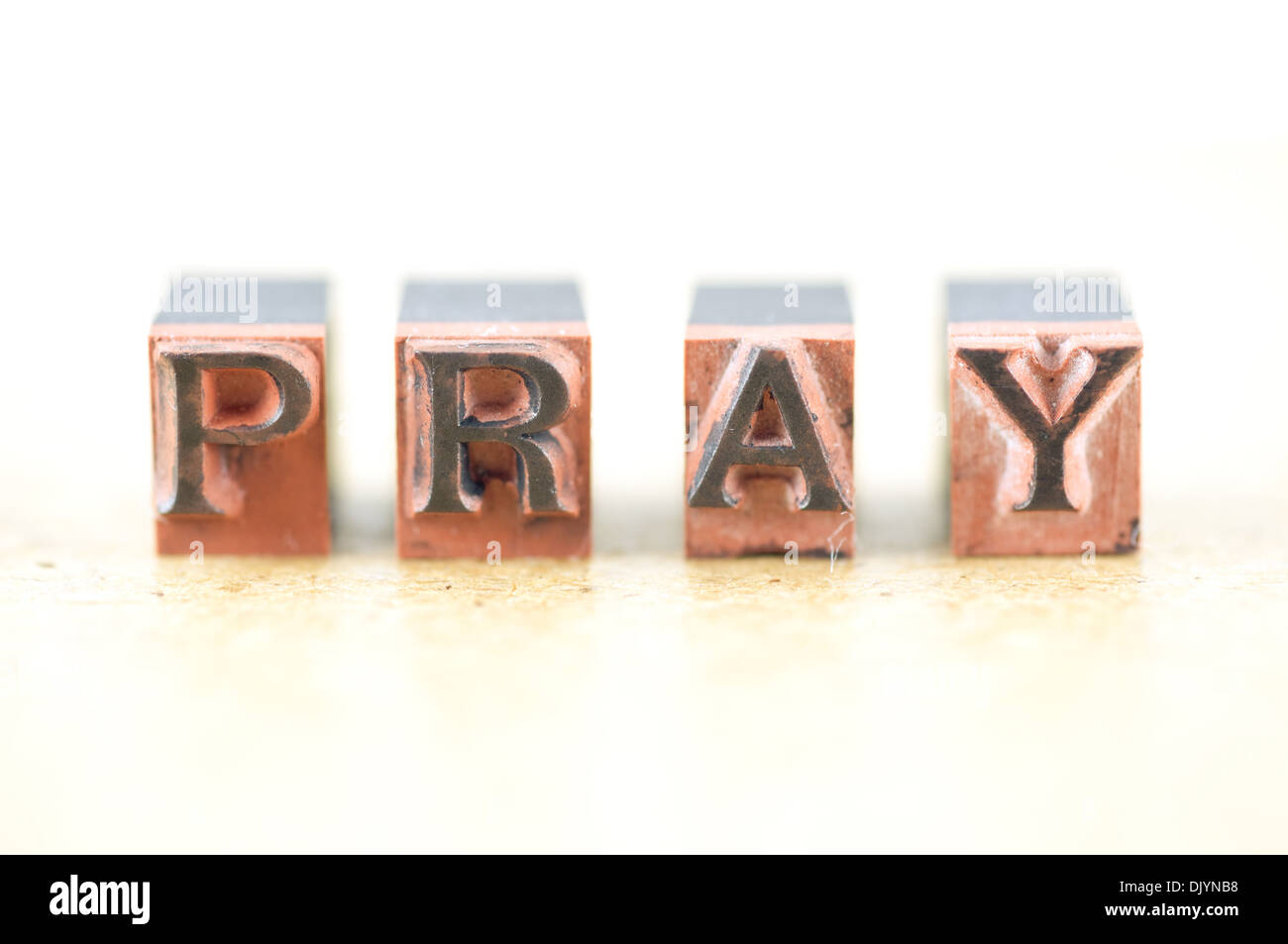 Word "pray" spelled out in letterpress letters Stock Photo - Alamy
