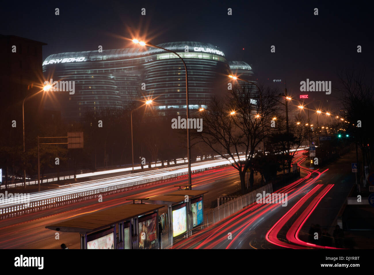 Downtown Beijing Futuristic building evening traffic Stock Photo - Alamy