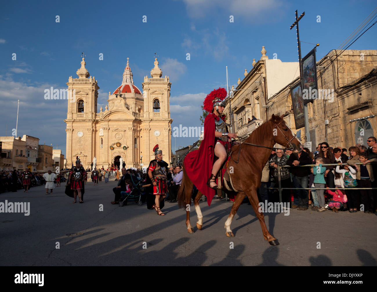 A man dressed as a Roman soldier on horseback parades through the ...