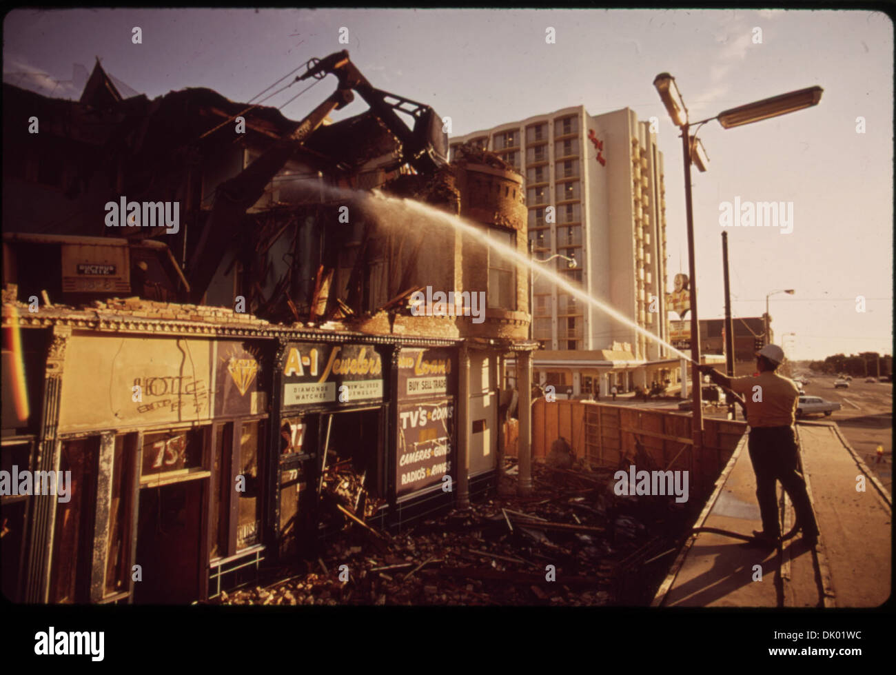 A building demolition is captured in this image, illustrating the ...