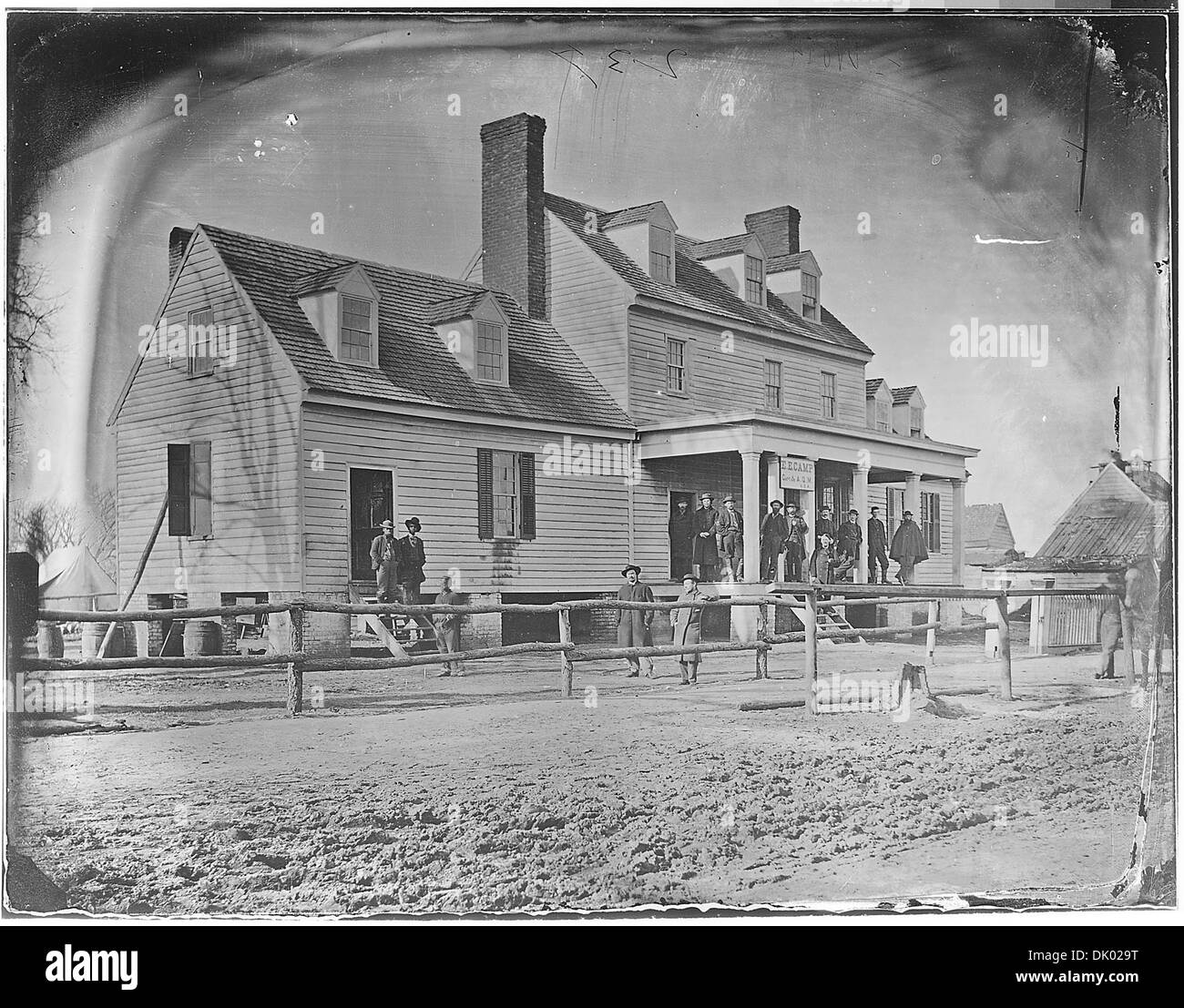 This image depicts a camp scene at E.F. Camp, with Capt. and A.O.M ...