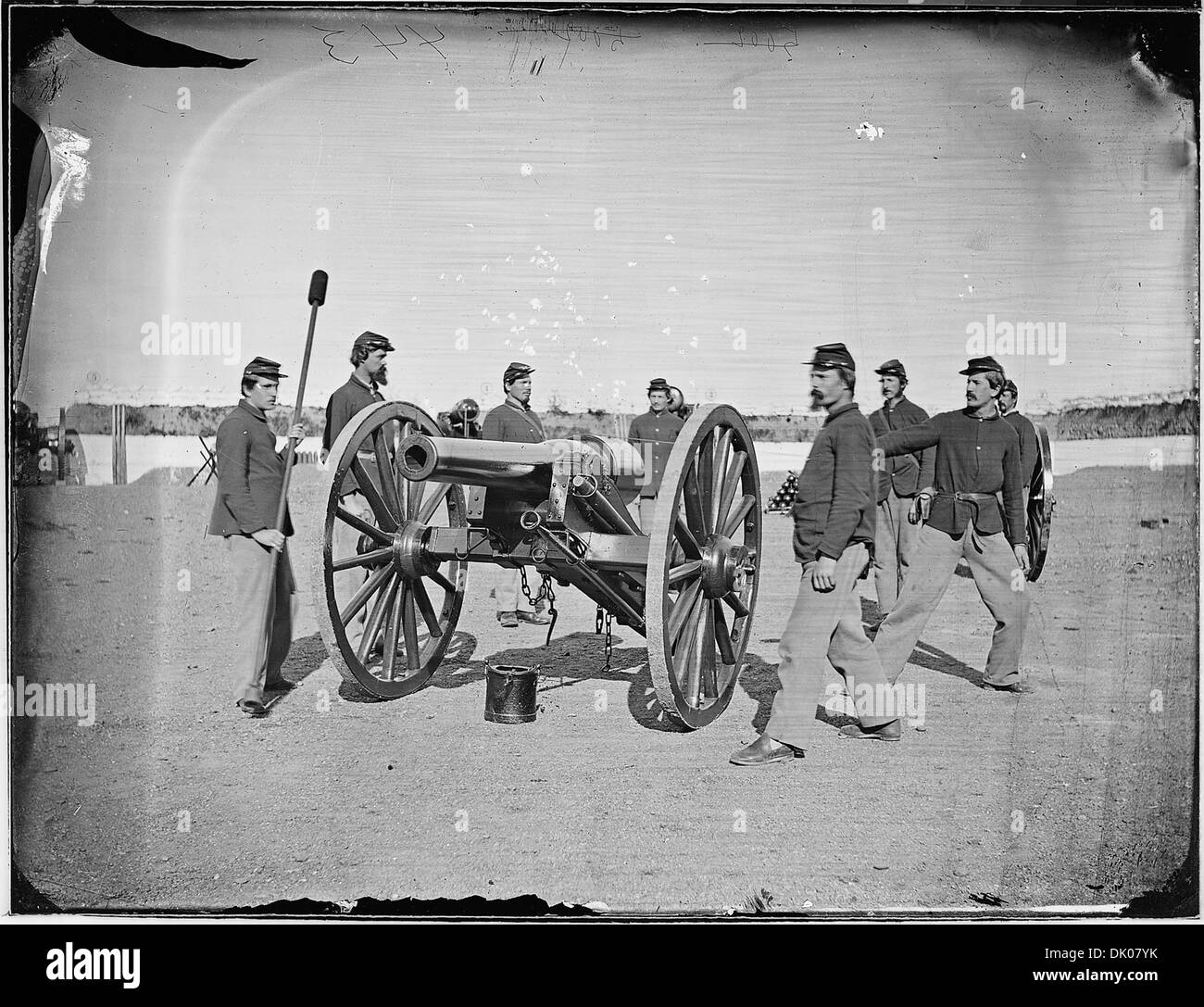 A gun squad conducts drill exercises, showcasing military training and ...