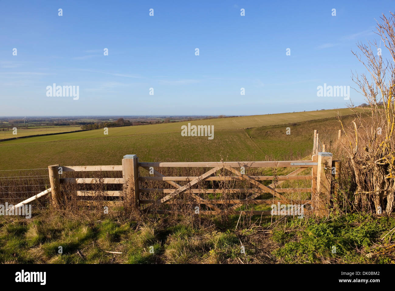 Traditional wooden farm gates overlooking the valley of Cleaving coomb ...