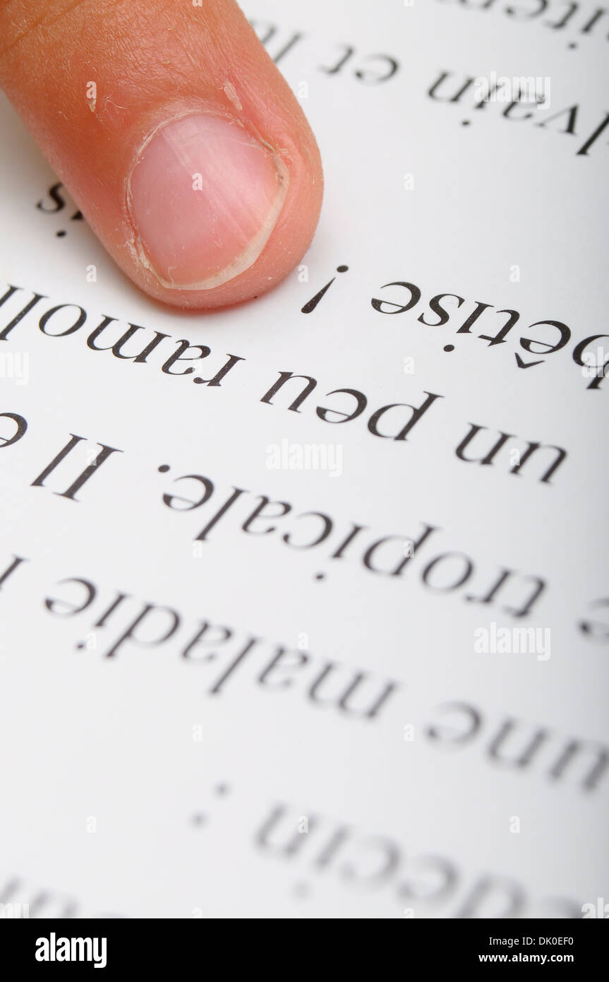 Child reading dictionnary on word reading Stock Photo - Alamy