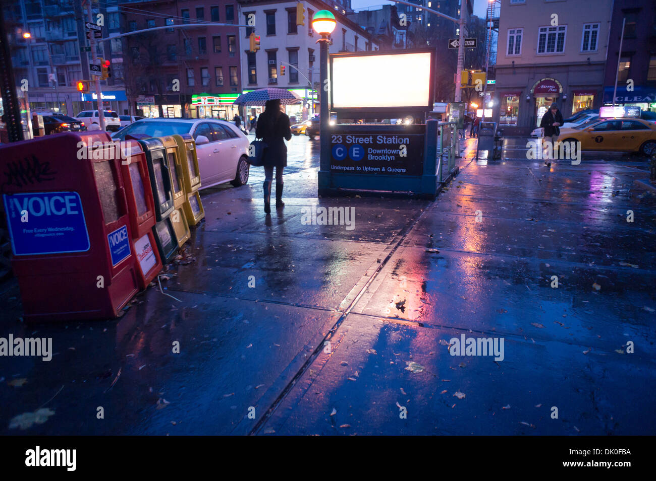 A subway entrance in the Chelsea neighborhood of New York on a rainy ...