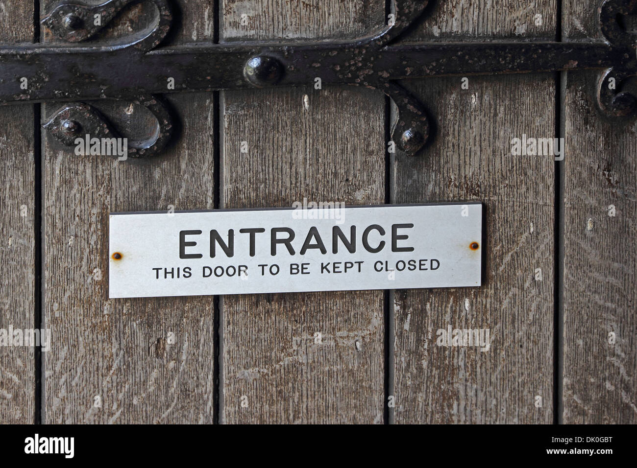 Entrance sign on wooden door Stock Photo - Alamy