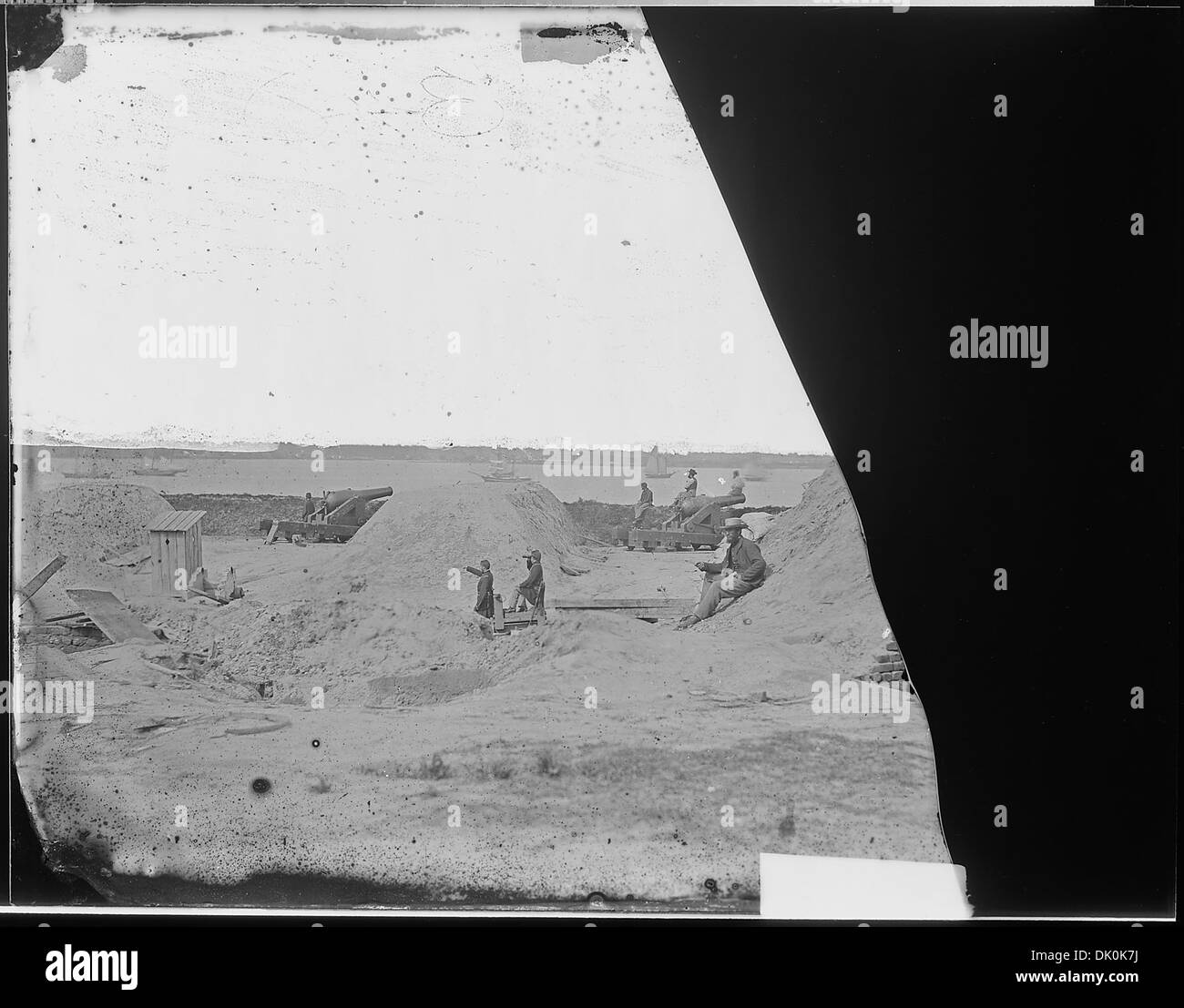 An image showing the interior of a fort located along a river. The ...