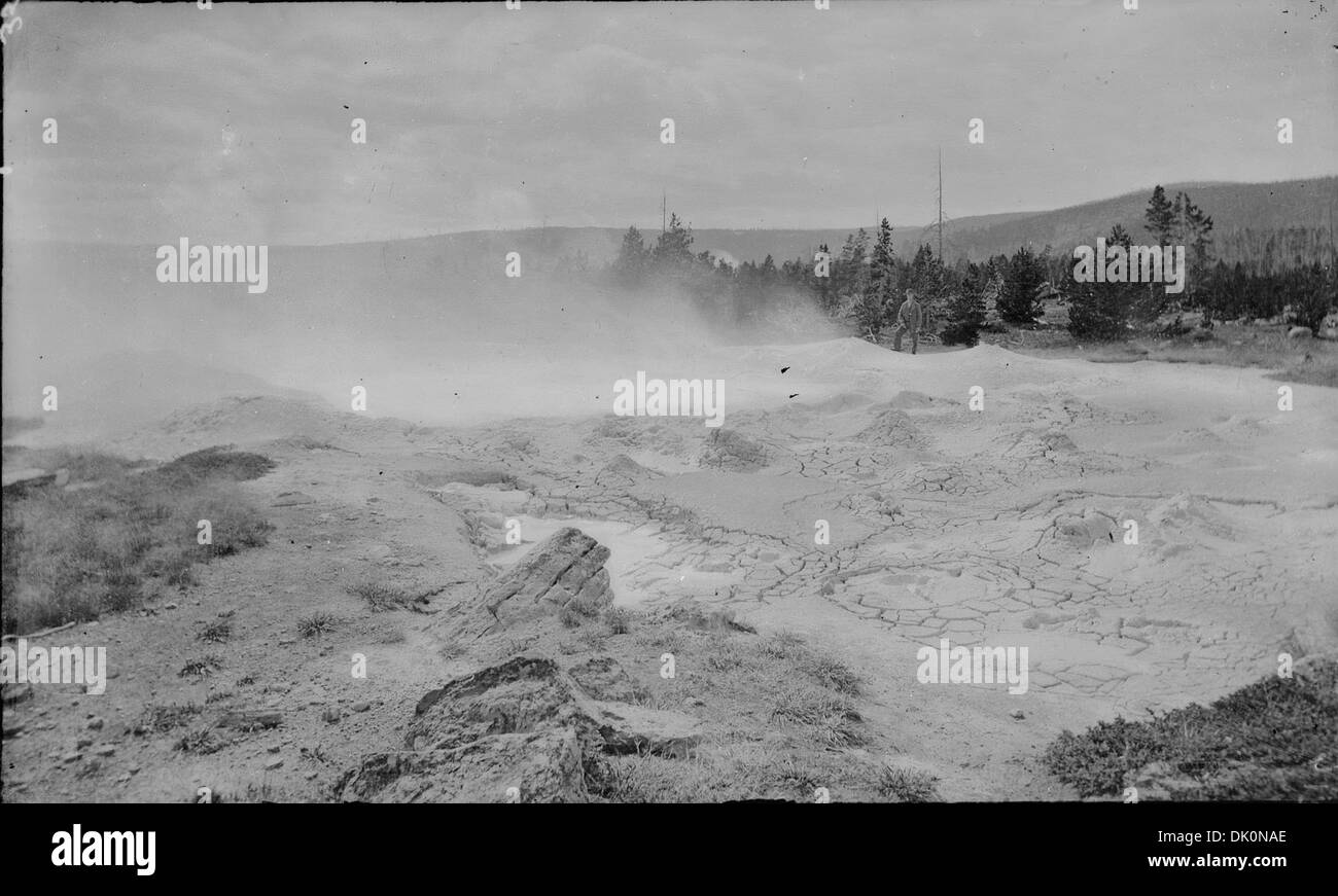 This photograph captures the Lower Fire Hole, a boiling mud spring in ...