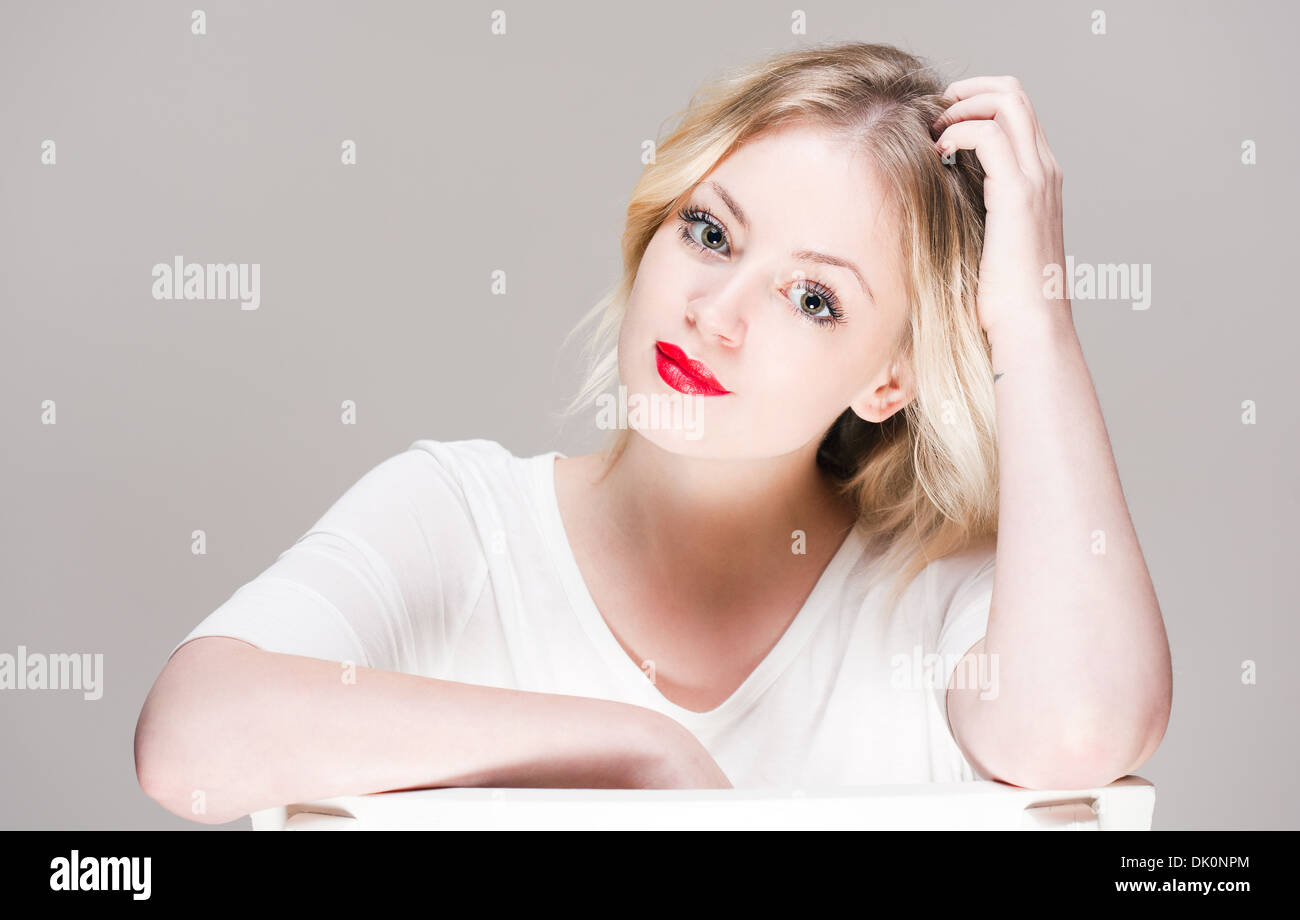 Portrait Of A Fair Skinned Blond Beauty With Bright Red Lips Stock