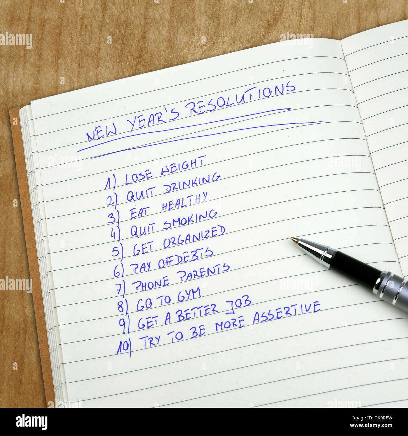 New Year's resolutions listed in the notepad Stock Photo - Alamy