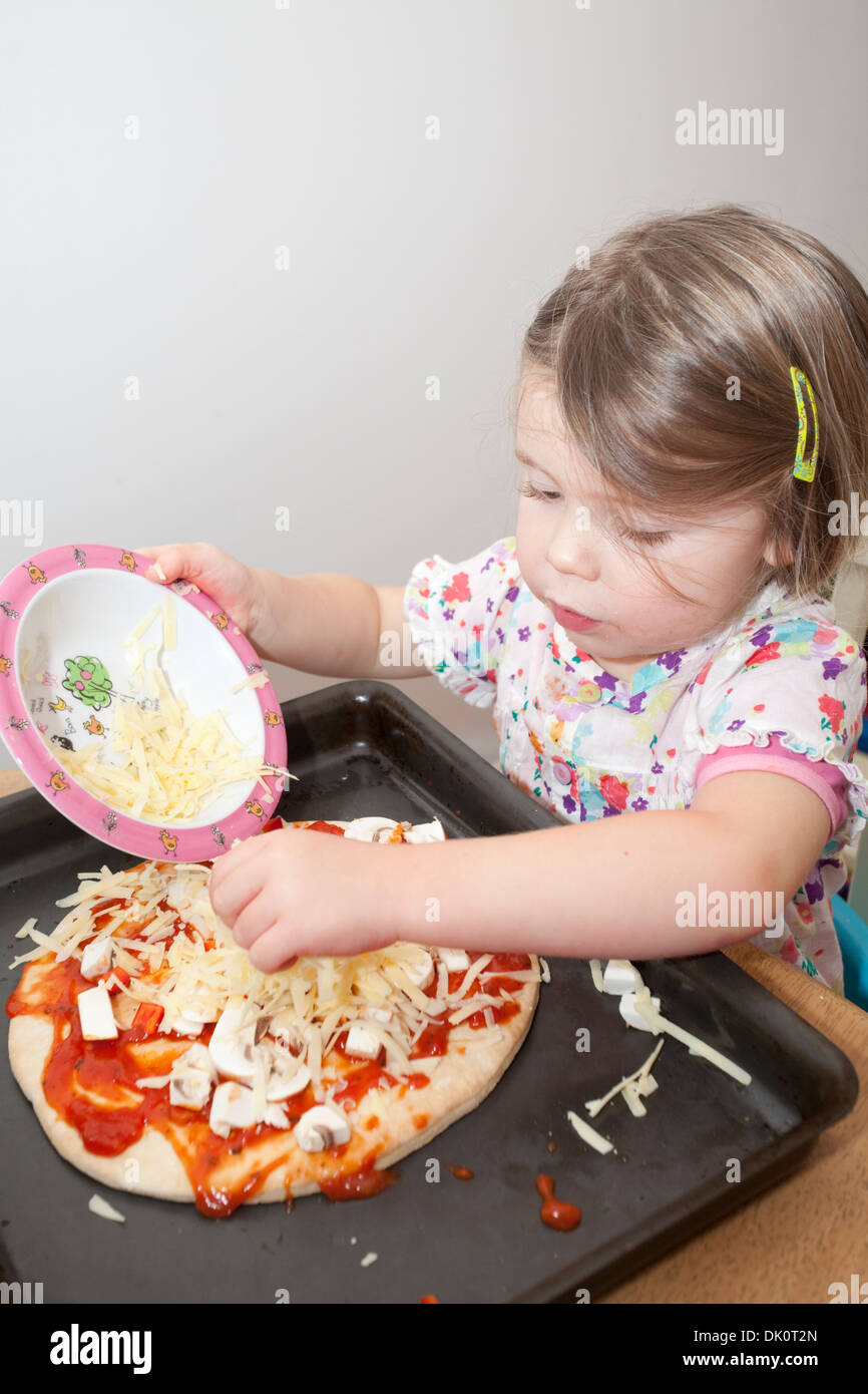 young girl making pizza Stock Photo - Alamy