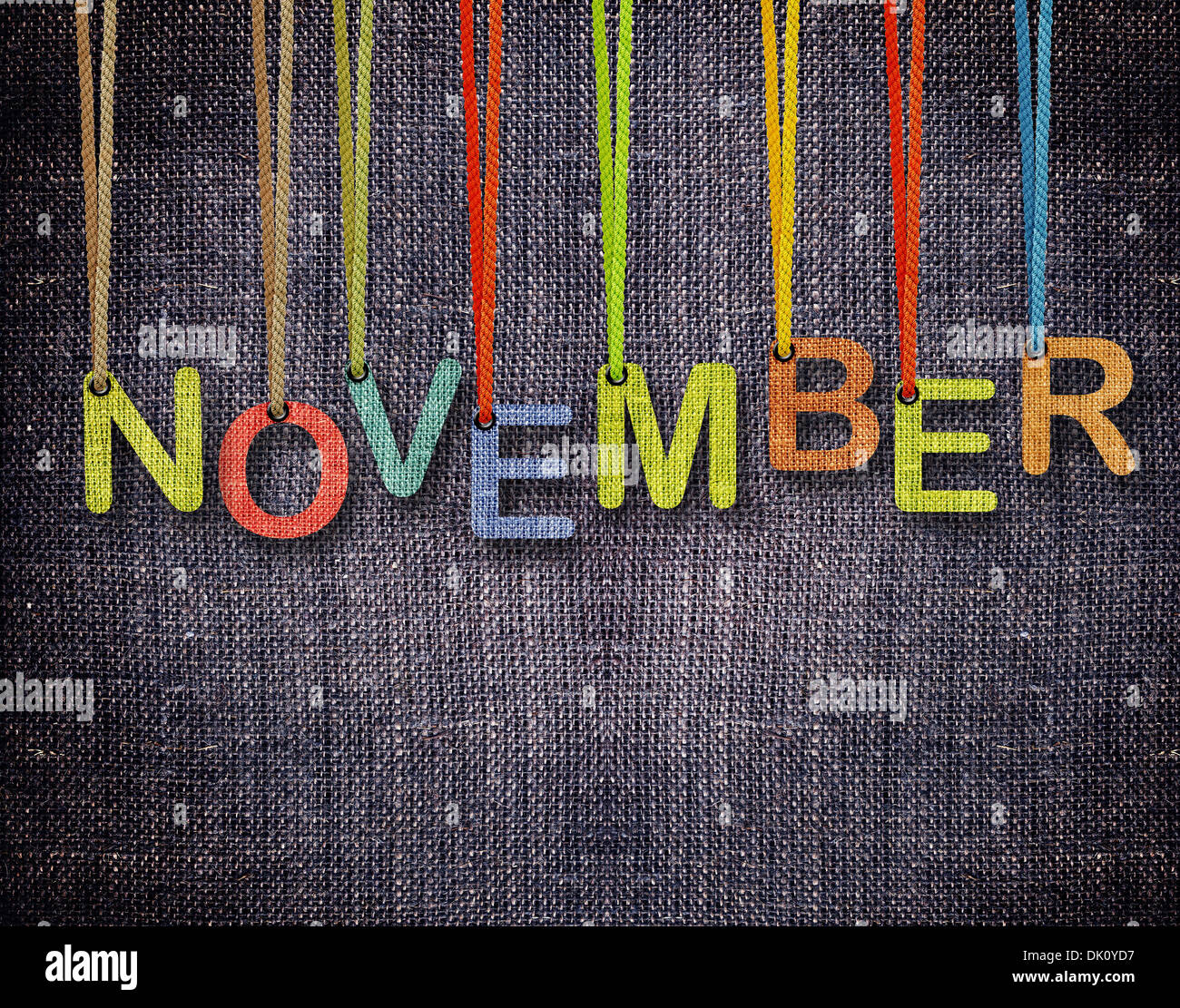 November letters hanging strings with blue sackcloth background Stock ...