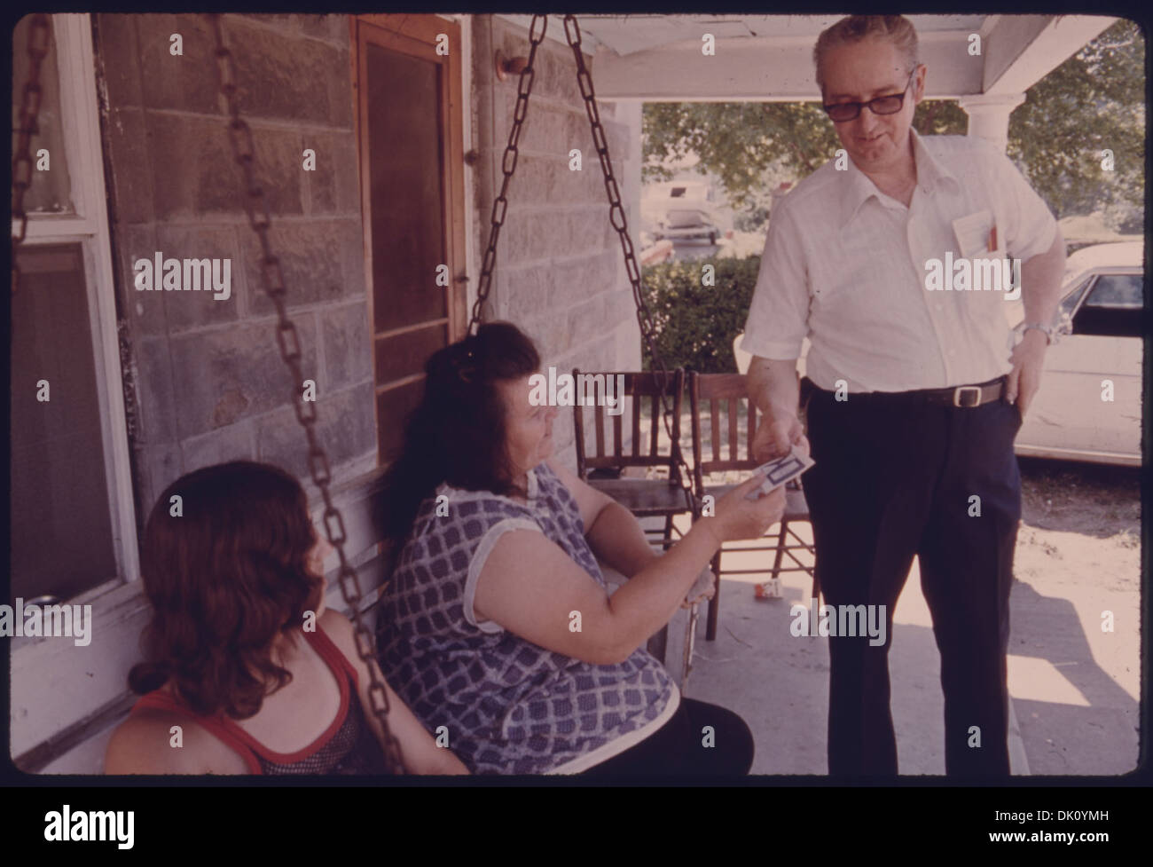 Mrs. May Watkins and her son Billy engage in a conversation with a ...