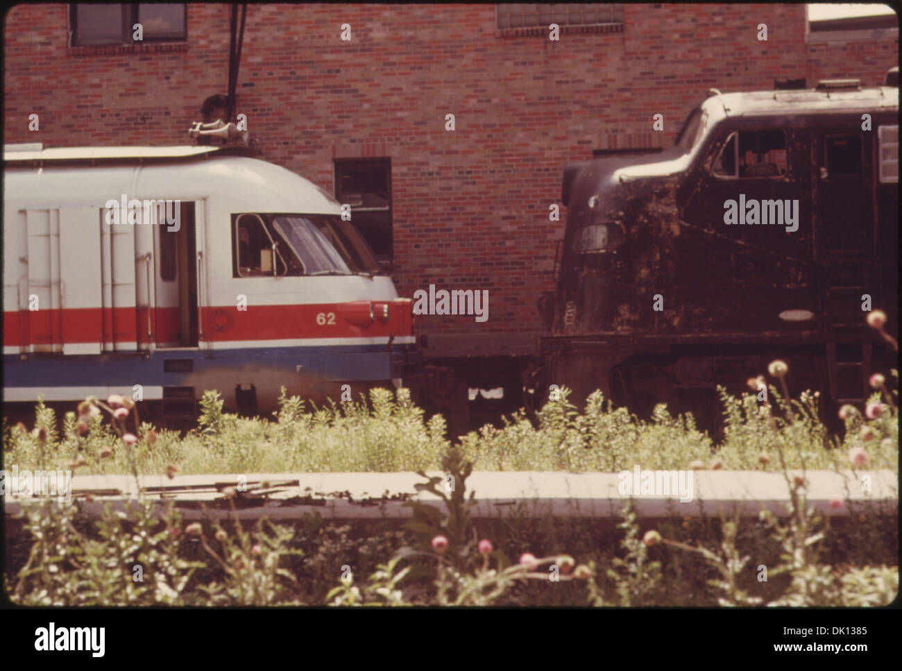 A modern Amtrak Turboliner passenger train engine contrasts with an ...